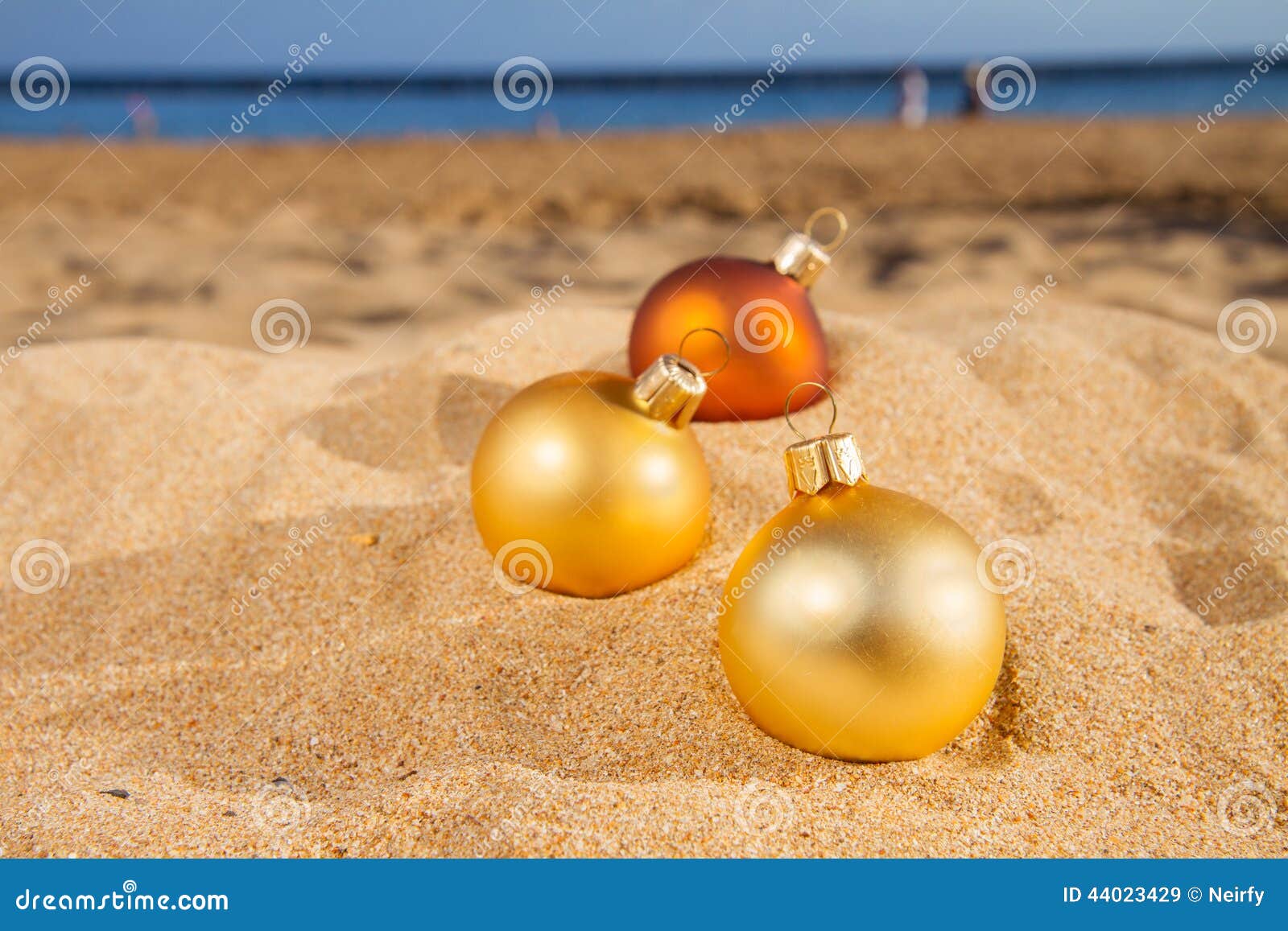 Christmas balls on beach stock image. Image of seasonal - 44023429