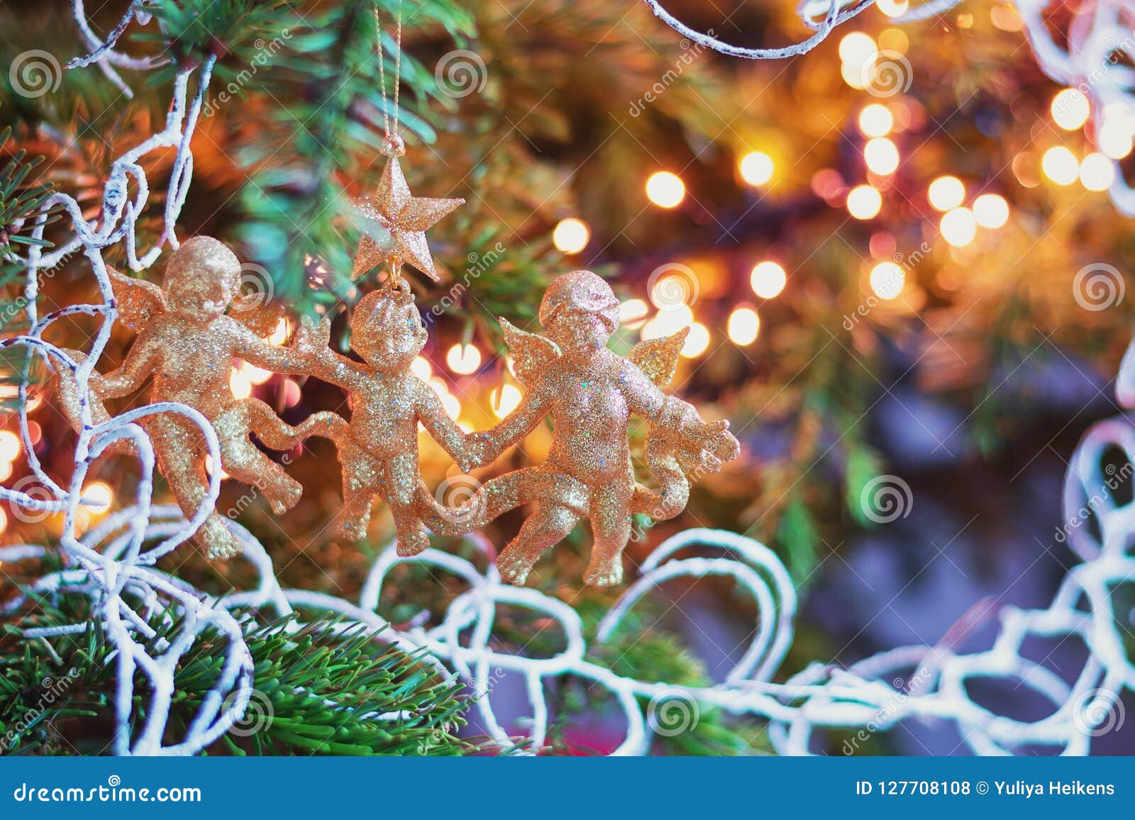 Christmas Branch Adorned with Three Golden Cherubs Stock Photo - Image ...