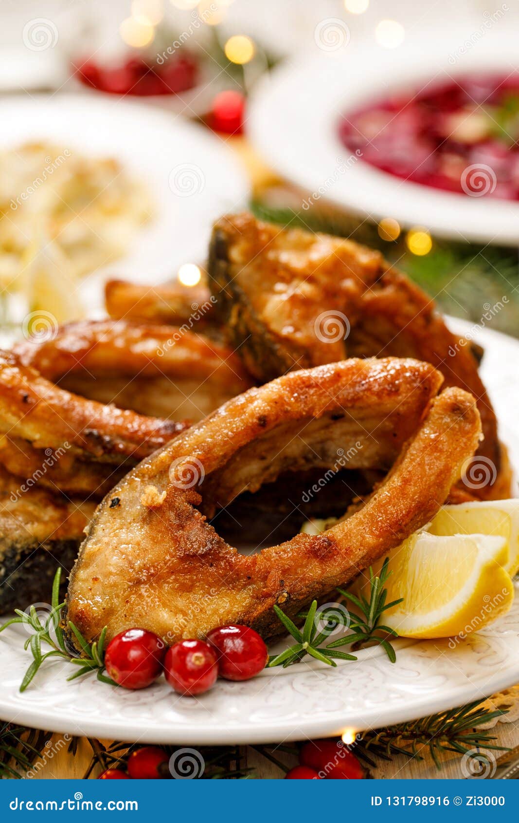 Christmas Carp, Fried Carp Fish Slices on a White Plate, Close Up ... Christmas Carp, Fried Carp Fish Slices on a White Plate, Close Up ...