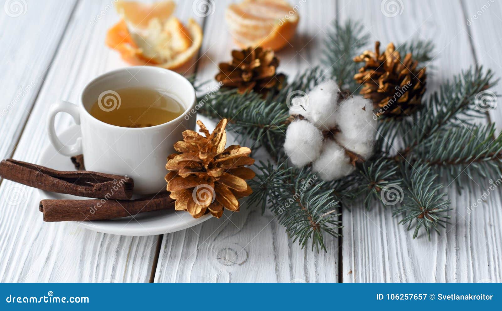 A Christmas Composition with a Cup of Tea, Cones, Fur Twigs and ...