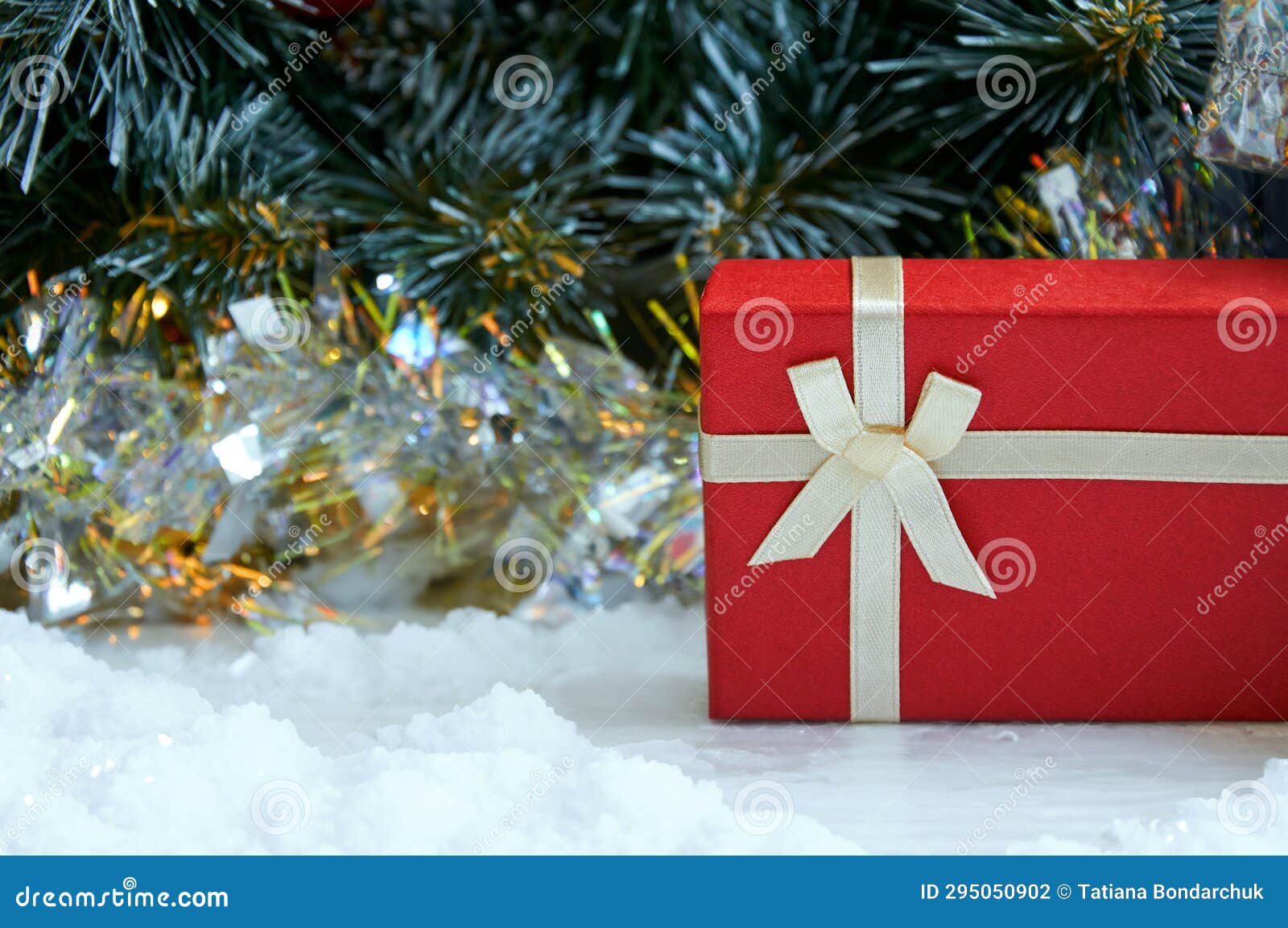 Christmas Composition with Christmas Tree Branches, Red Tinsel, Gift ...