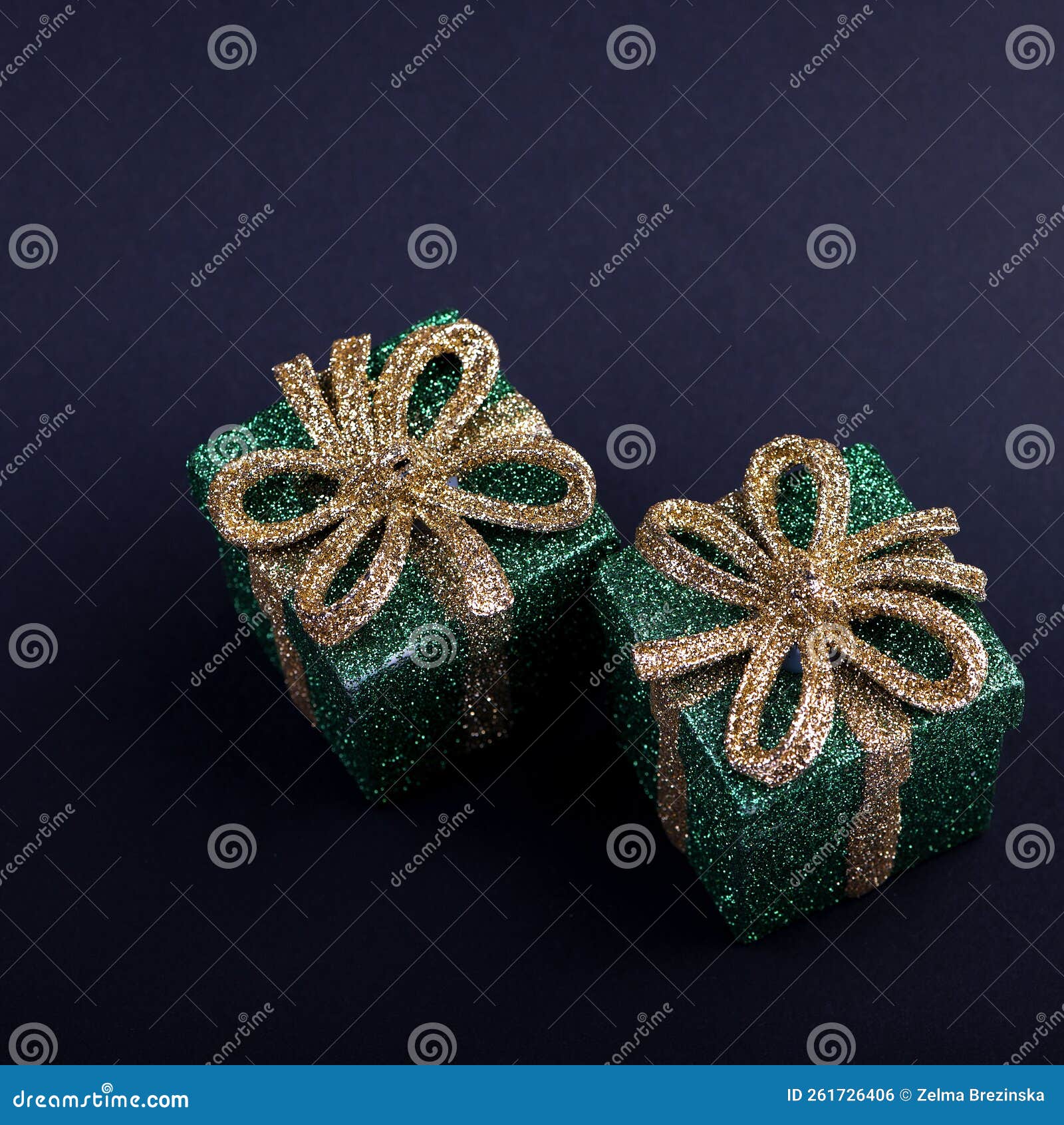 Christmas Decor Green Gift Boxes with Shiny Gold Bow on Dark Square ...