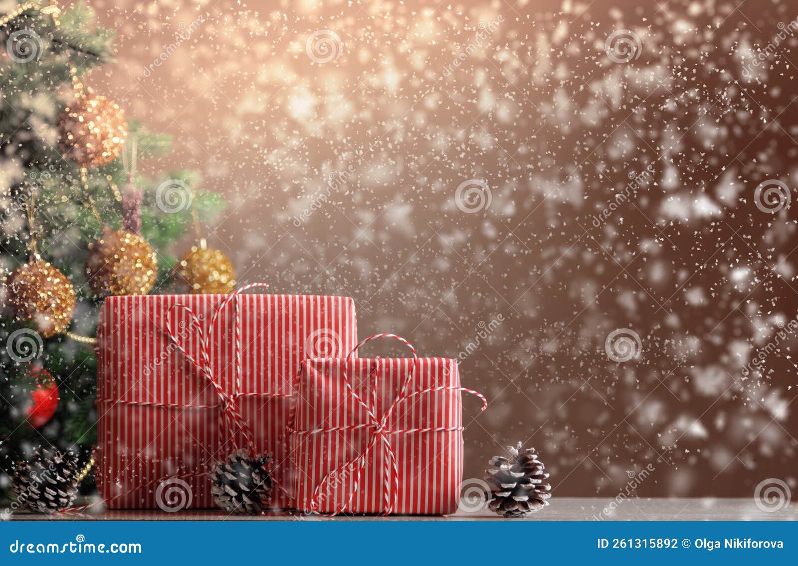 Christmas Decorated Tree with Gift Boxes in Defocused Snowfall. Holiday ...