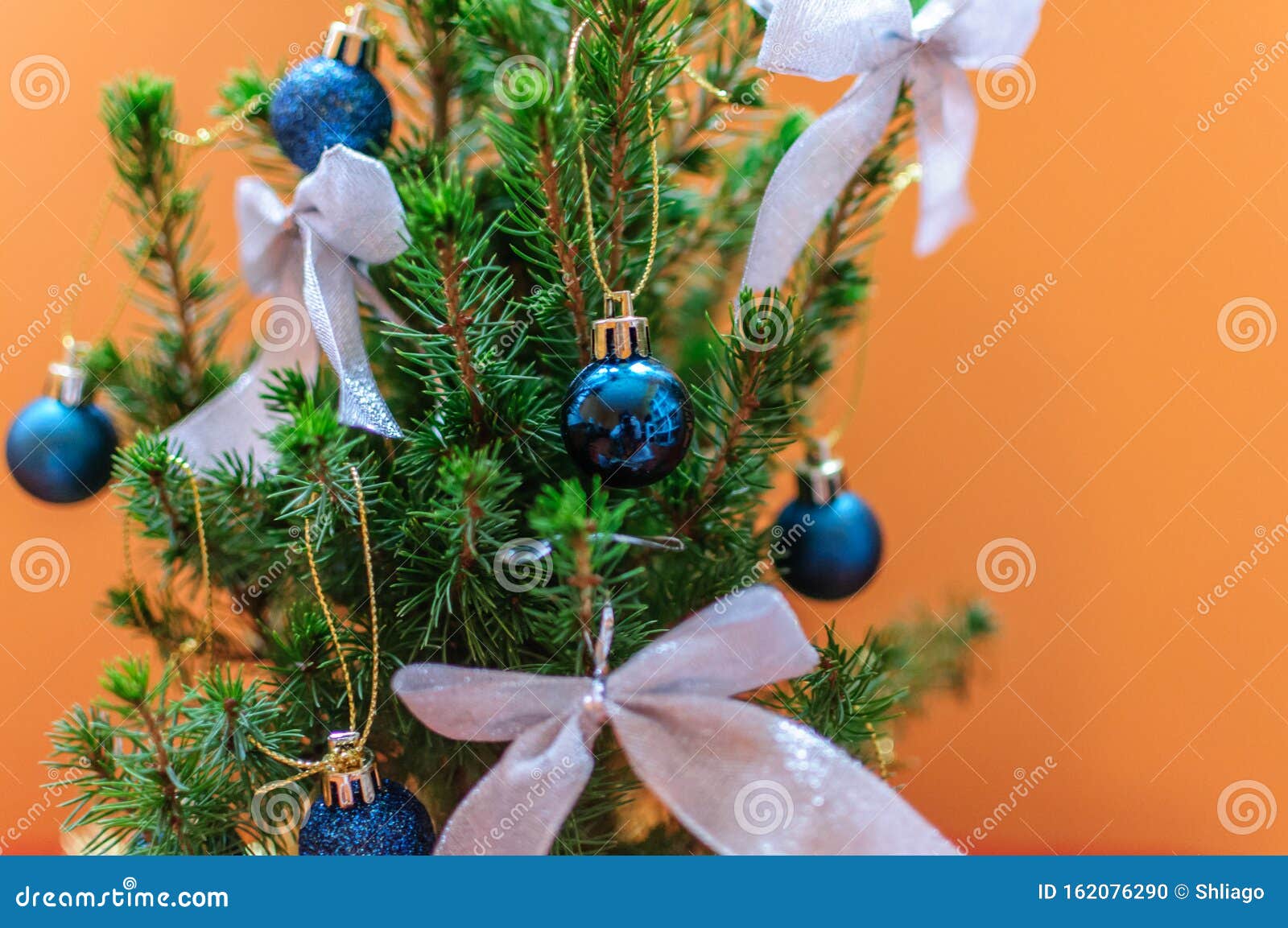 Christmas Decorations Blue Balls and Silver Bows on Pine Tree Stock ...