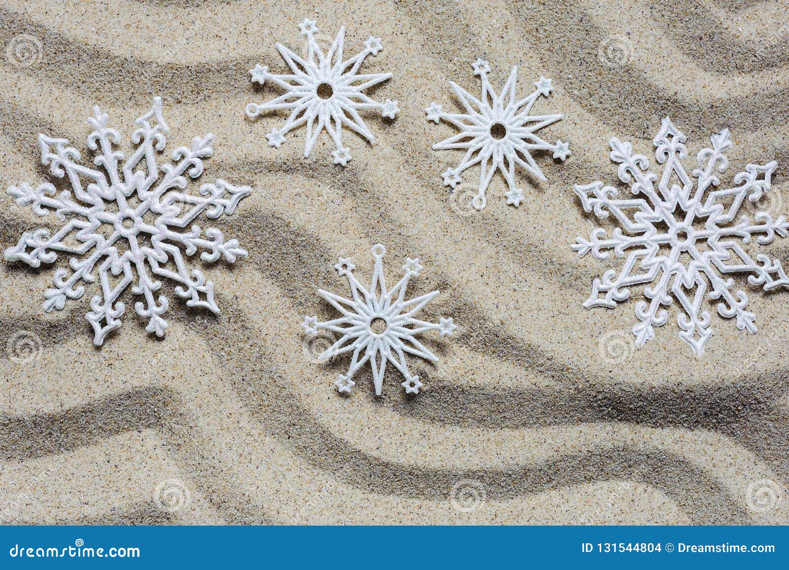 Christmas Decorative Snowflakes Lie on the Beach Sand Stock Photo ...