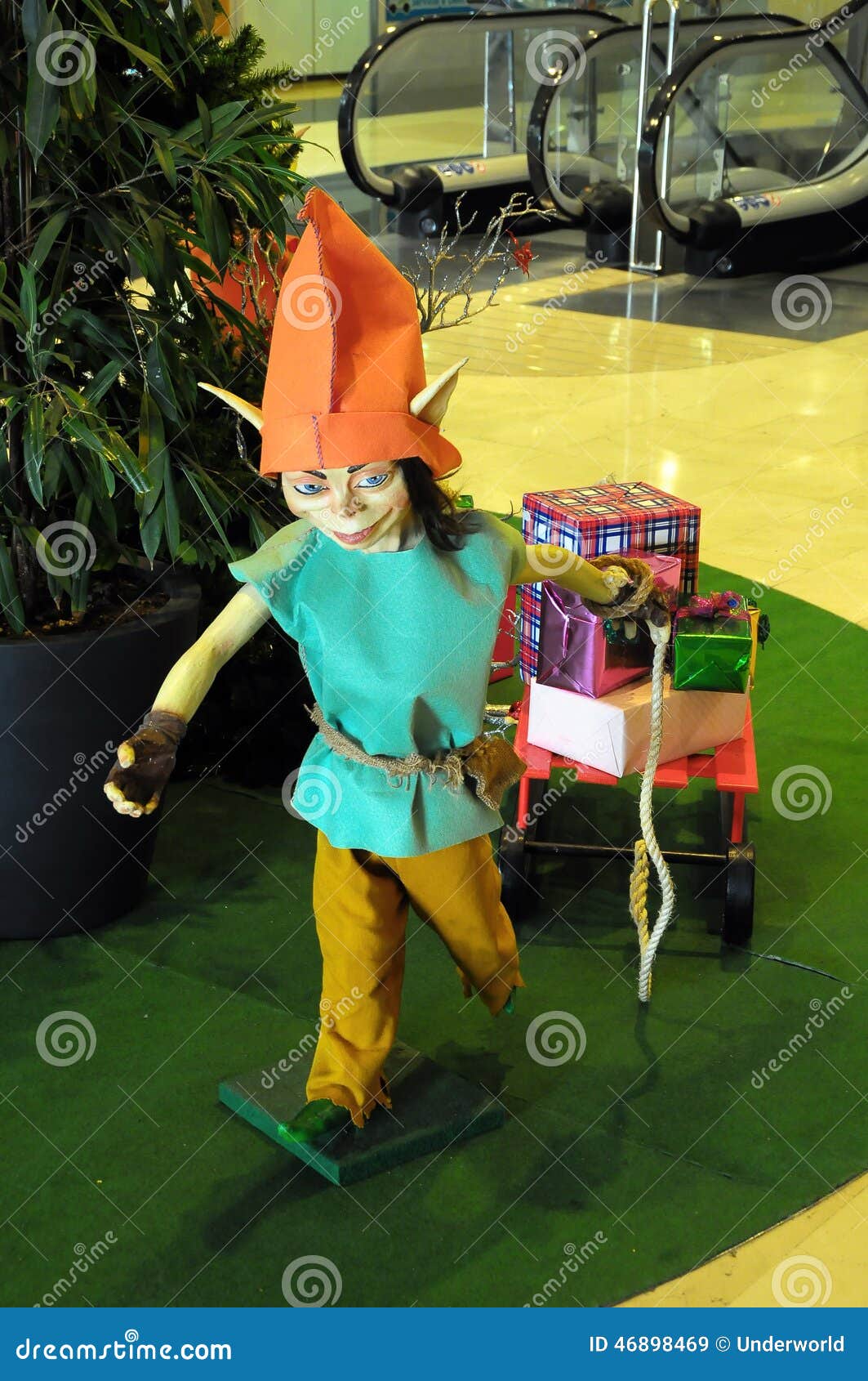 Christmas elf with gifts stock image. Image of child - 46898469