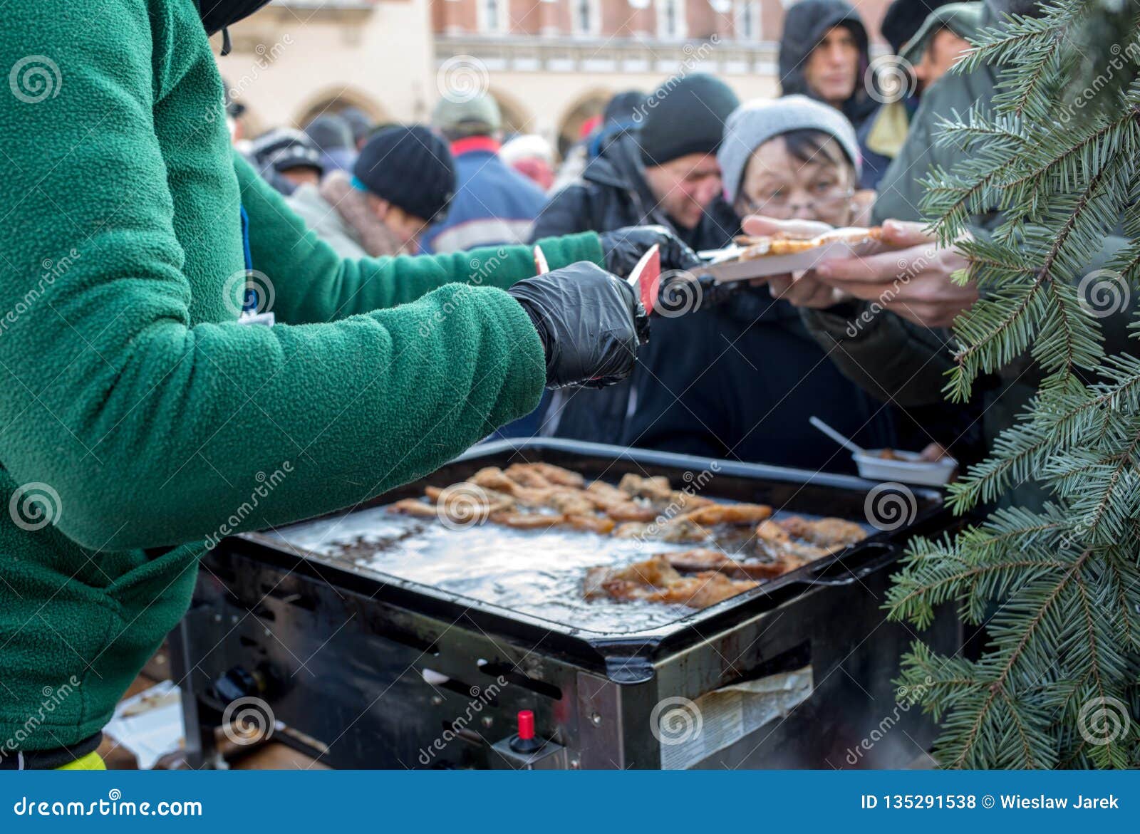 Christmas Eve for Poor and Homeless on the Main Square in Cracow ... Christmas Eve for Poor and Homeless on the Main Square in Cracow ...