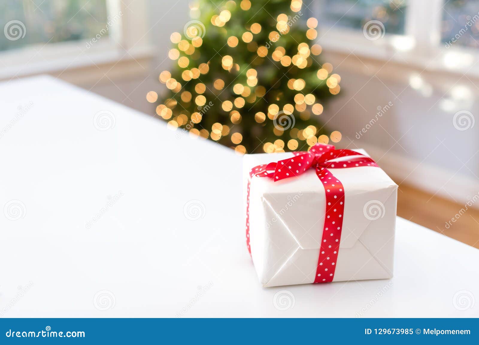 Christmas Gift Box on a Table Stock Image - Image of bright, oneroom ...