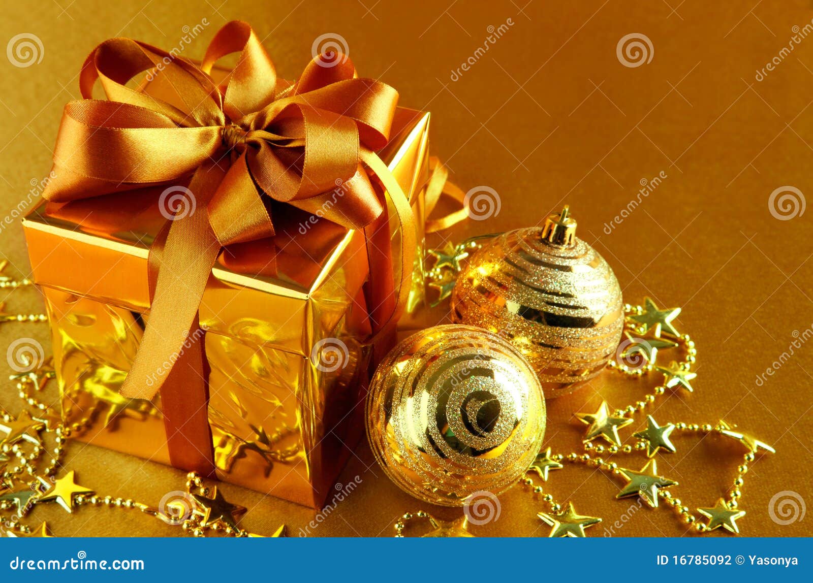Christmas Gift in Gold Box with Bow Stock Photo - Image of packaging ...