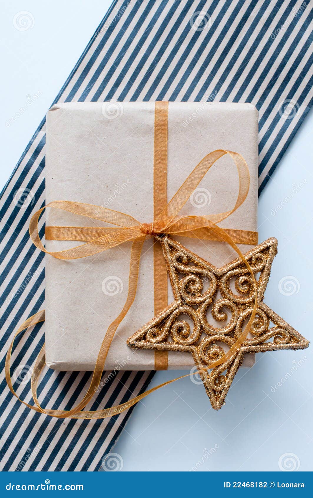 Christmas Gift with a Golden Star Stock Photo - Image of baked, ribbon ...