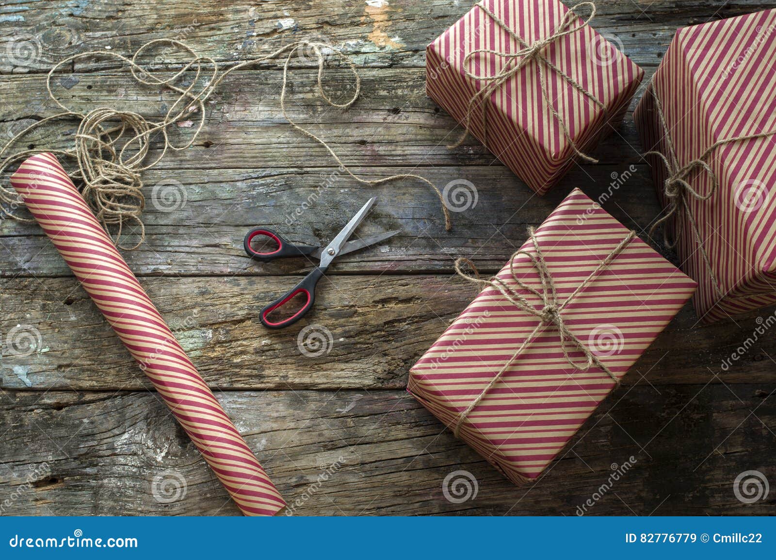 Christmas Gifts Being Wrapped on Rustic Table Stock Image - Image of ...