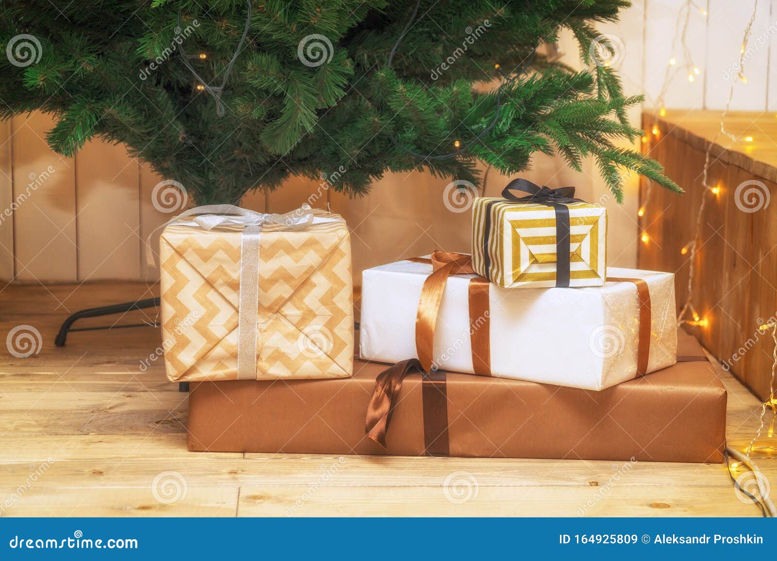 Christmas Gifts Packed in Holiday Boxes on the Floor Under Christmas ...