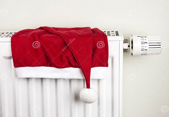 Christmas hat and radiator stock photo. Image of costume - 27881060