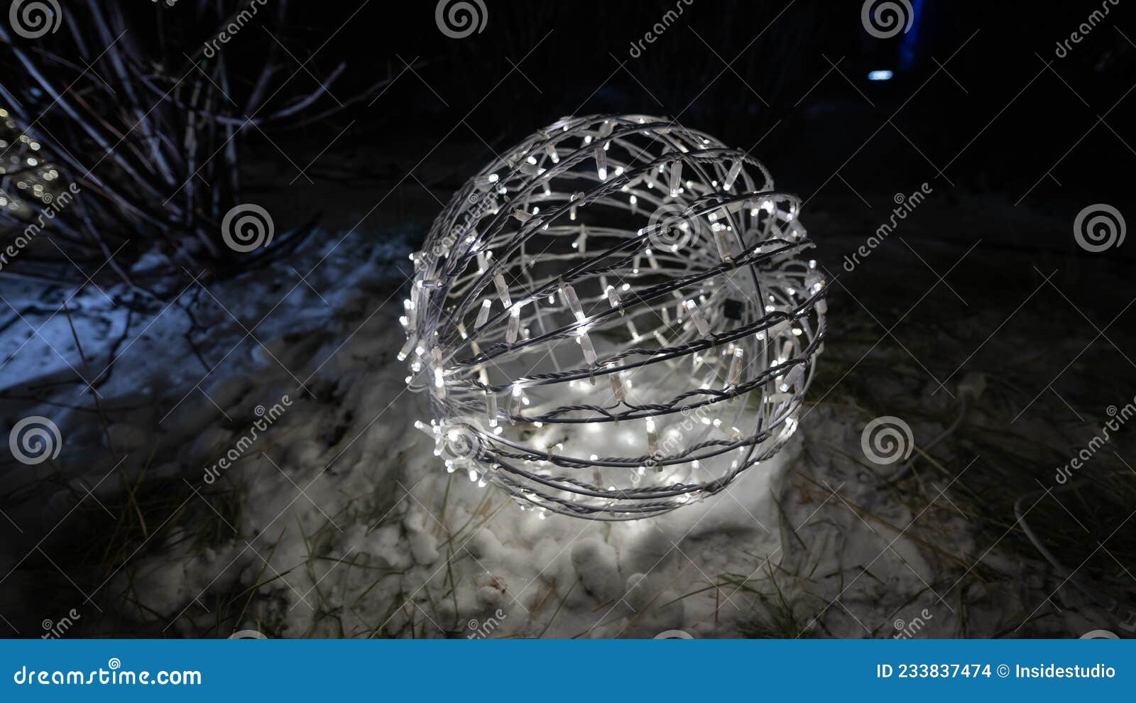 Christmas Lights in the Shape of a Ball on the Snow. Stock Photo ...