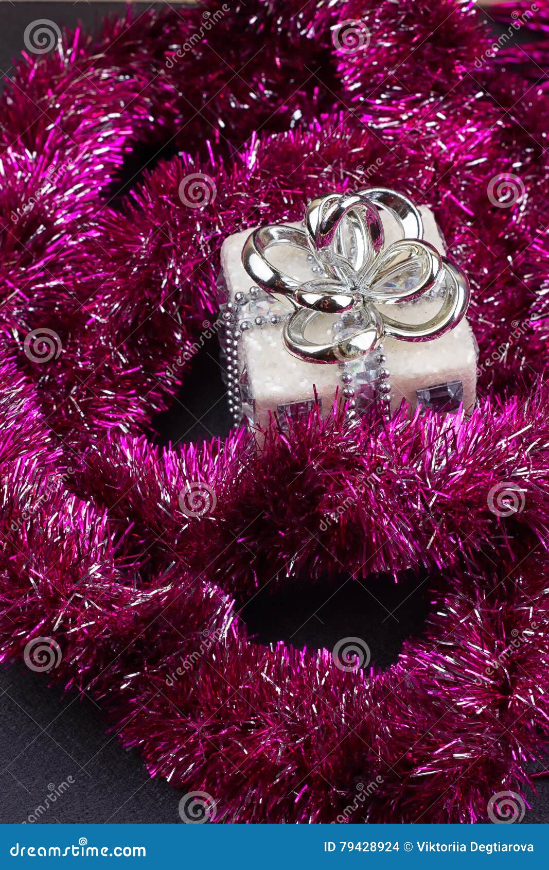 Christmas Present with Purple Garland Stock Photo - Image of garland ...