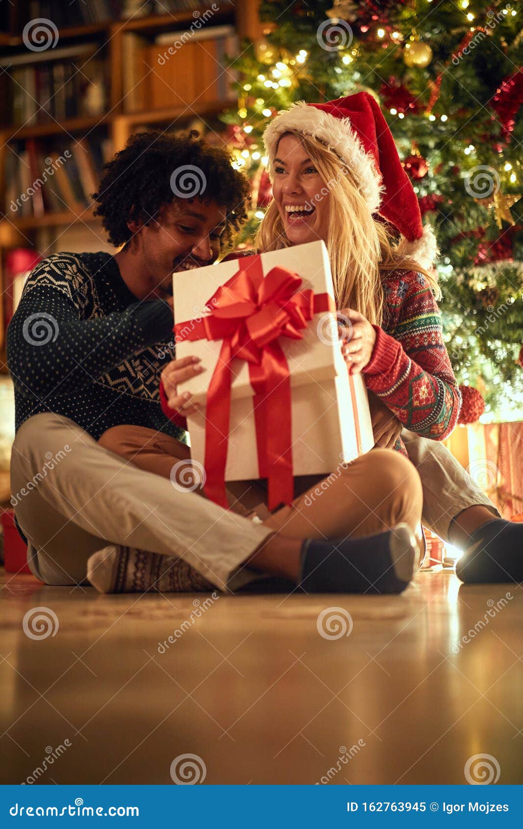 Christmas Presents. Couple Exchanging Christmas Gift Stock Image ...