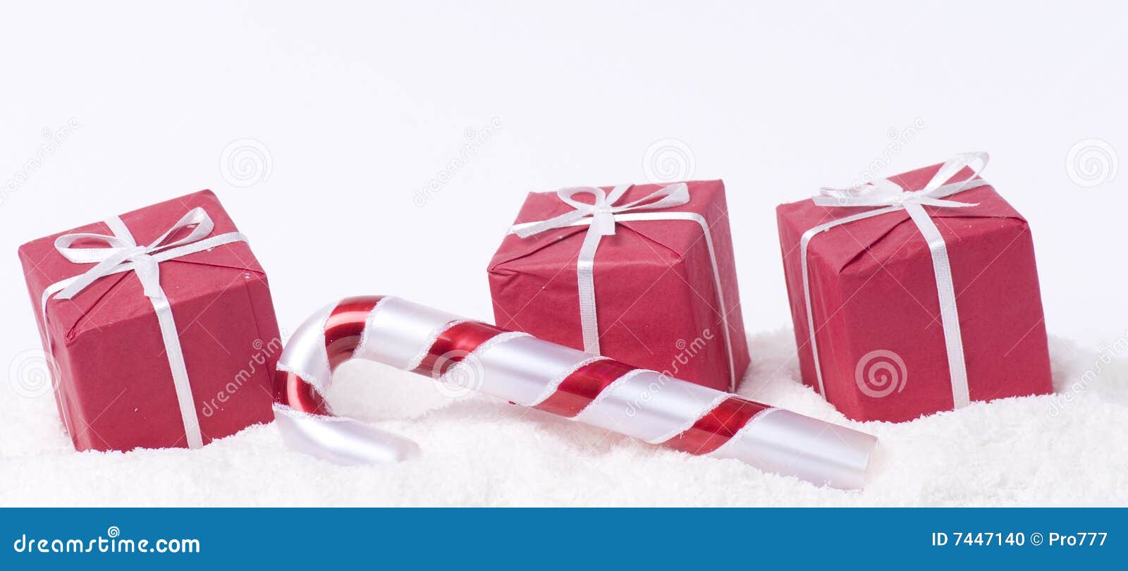 Christmas presents on snow stock photo. Image of paper - 7447140