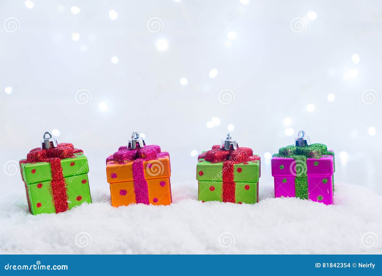Christmas presents in snow stock photo. Image of bokeh - 81842354