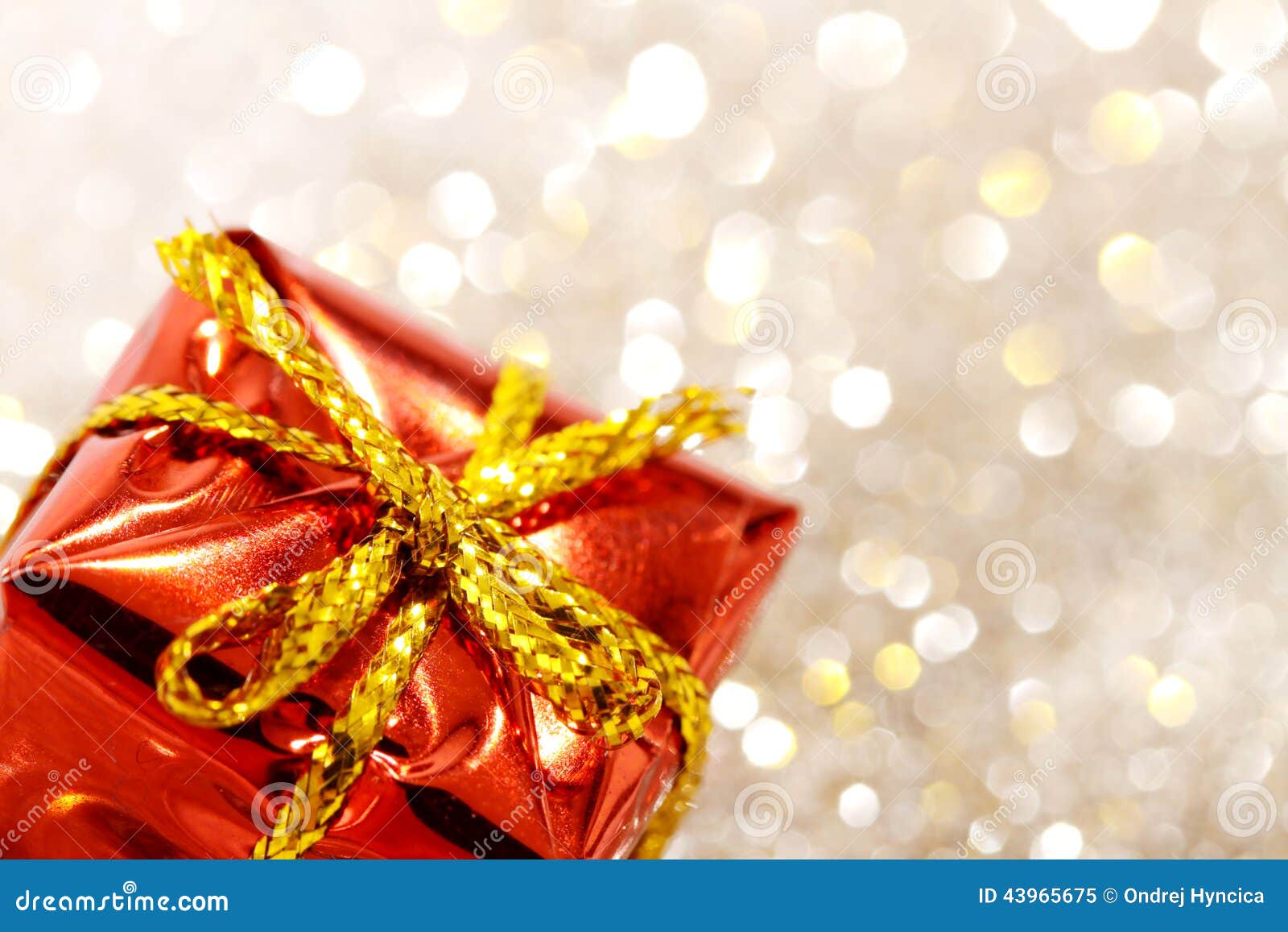 Christmas Red Gift Box with Yellow Bow on Glitter Silver and Gold ...