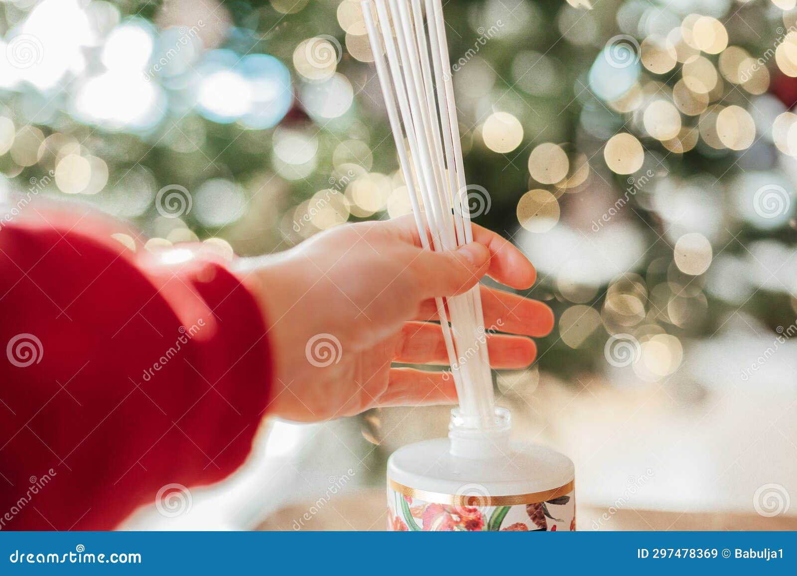 Christmas Scent.incense Sticks in a Hand on a Christmas Tree Background ...