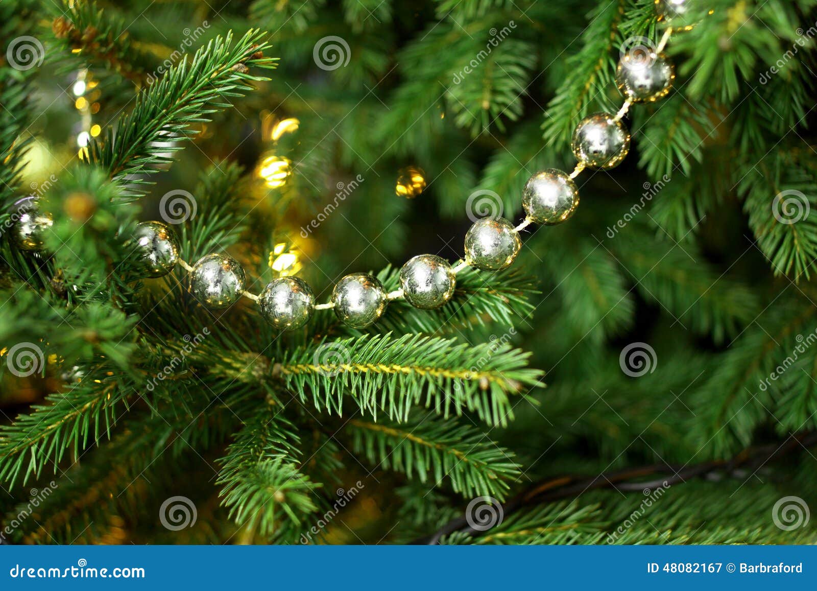 Christmas Silver Beads Hanging in a Christmas Tree Stock Image - Image ...