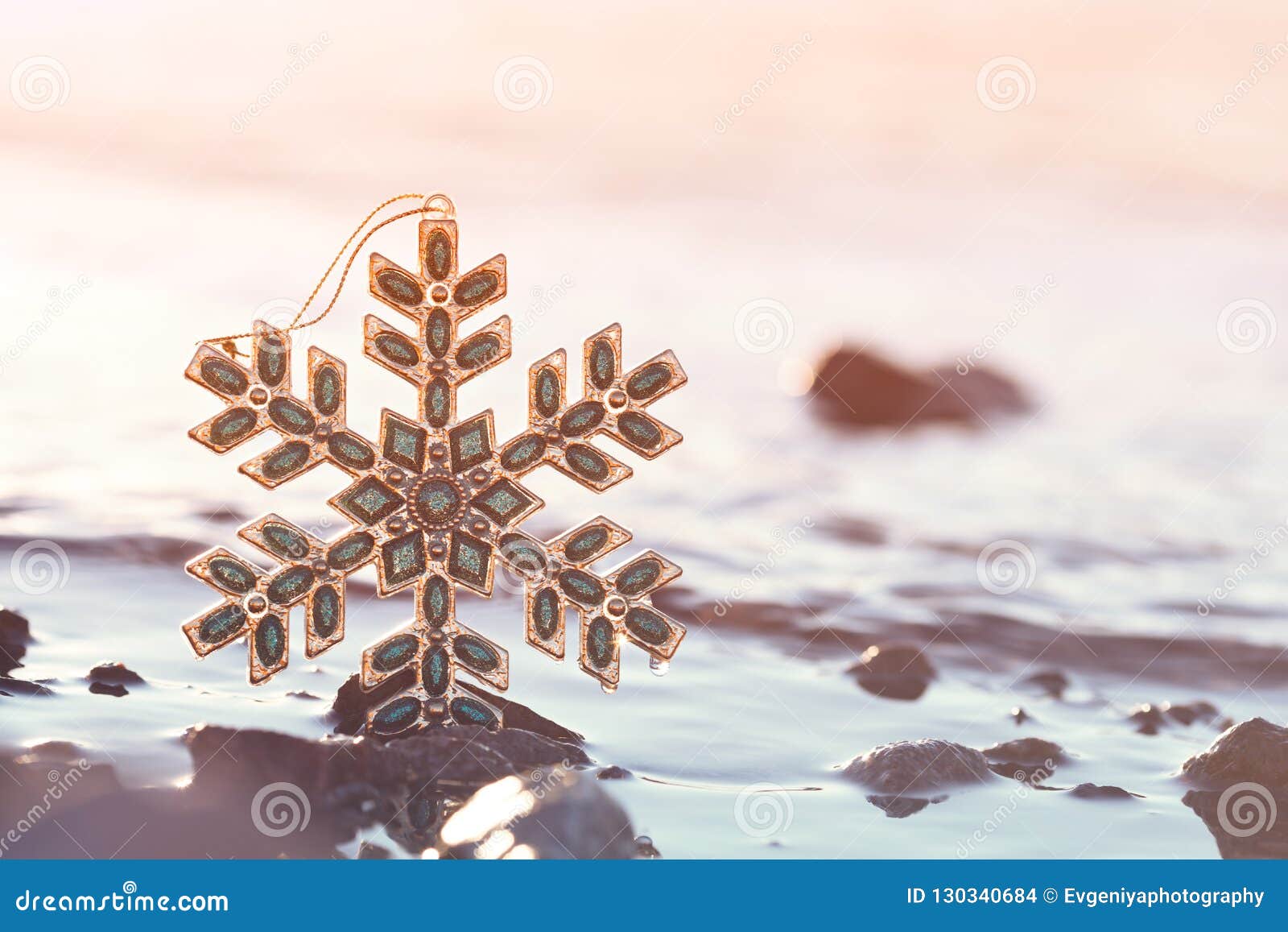 Christmas Snowflake at Sunset on the Beach Stock Photo - Image of decor ...