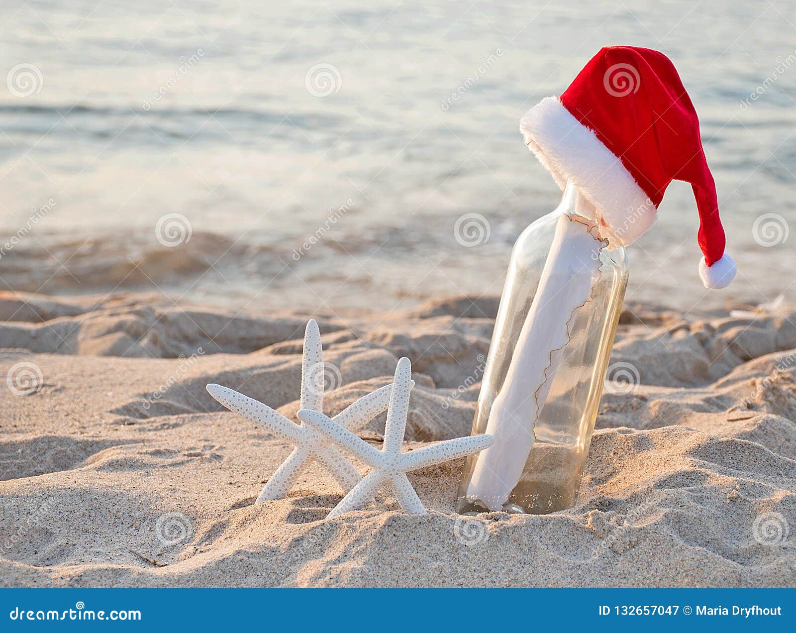 Christmas Starfish with Message in Bottle Stock Image - Image of sand ...