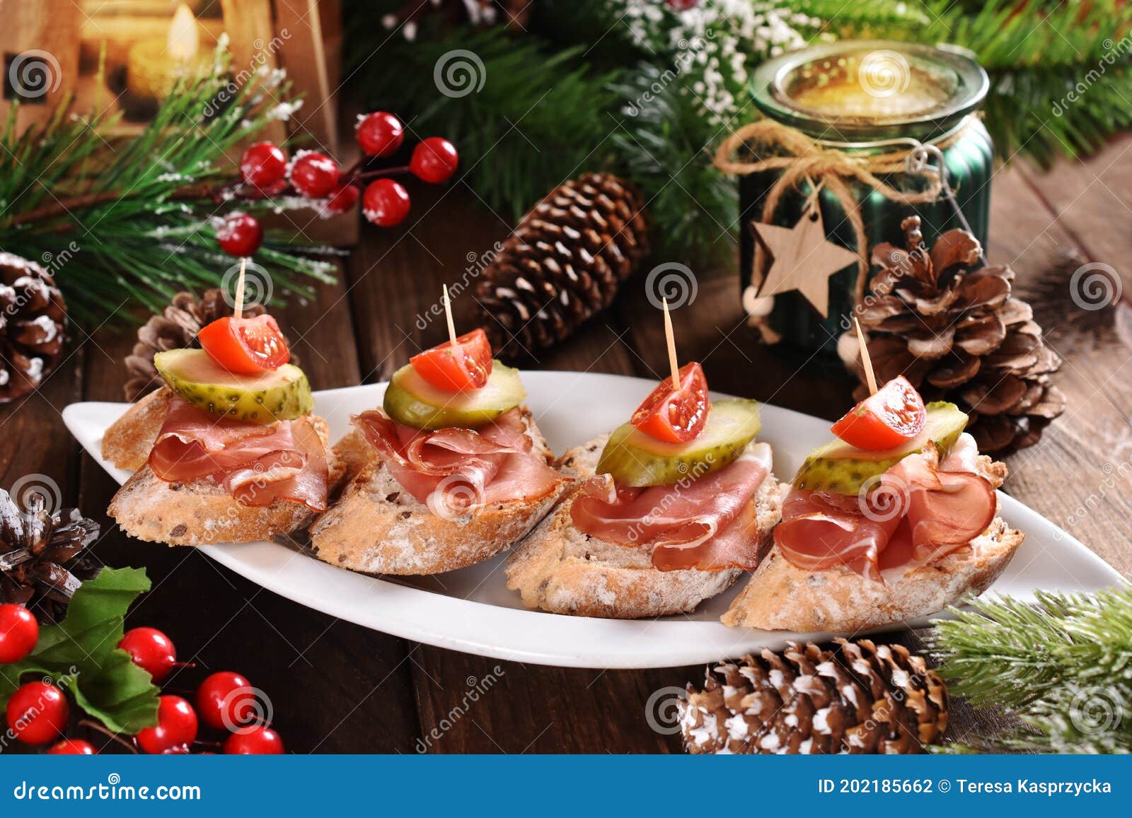 Christmas Table with Mini Canapes with Parma Ham and Pickled Cucumber ...