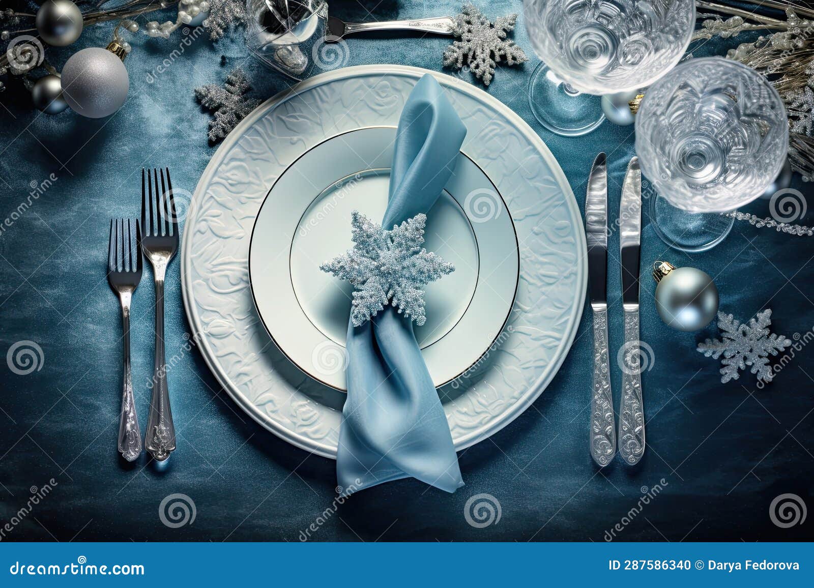 Christmas Table Setting with Dishware, Silverware and Decorations on ...