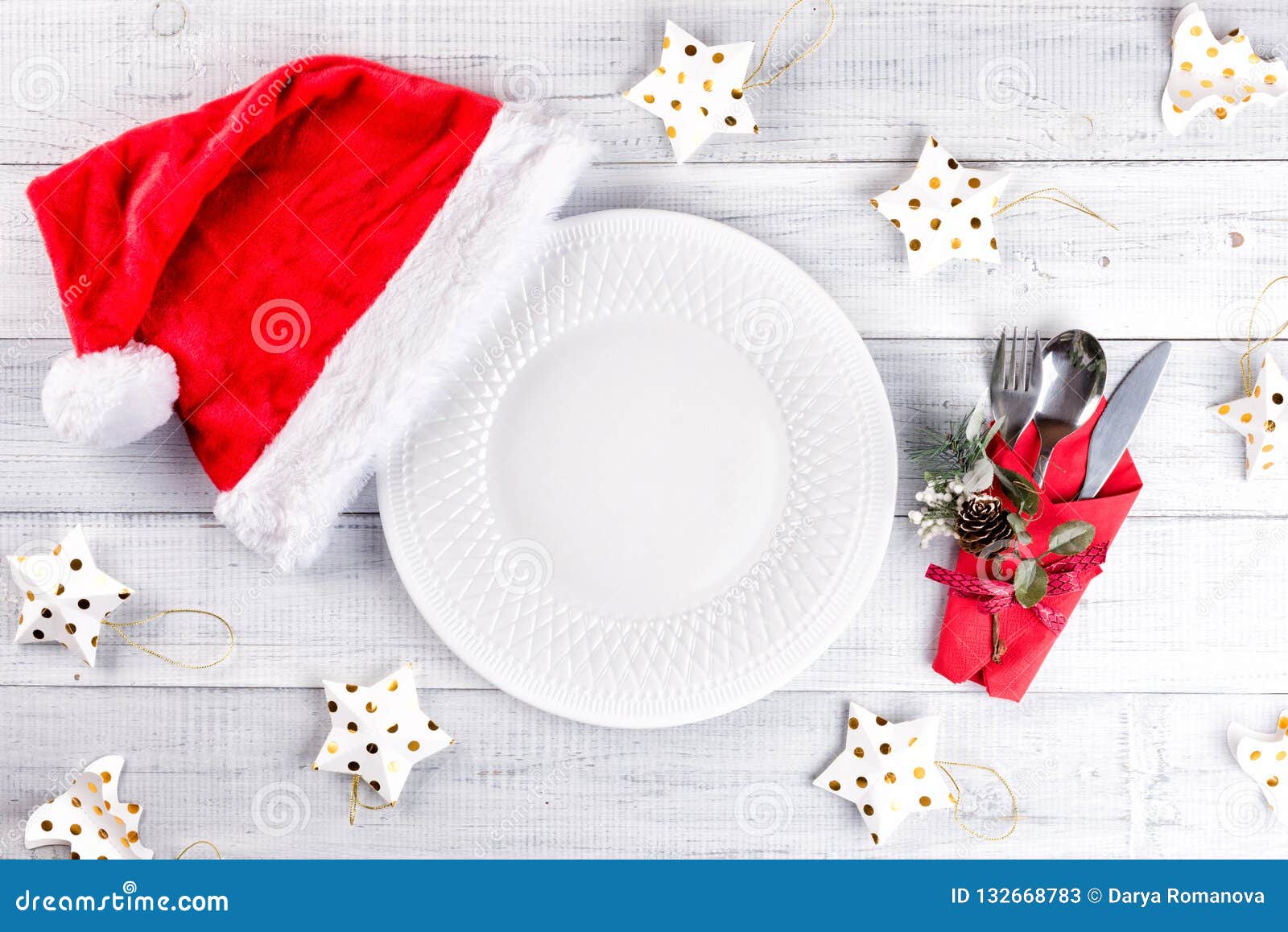 Christmas Table Setting with an Empty Plate and Red Santa Hat Stock ...