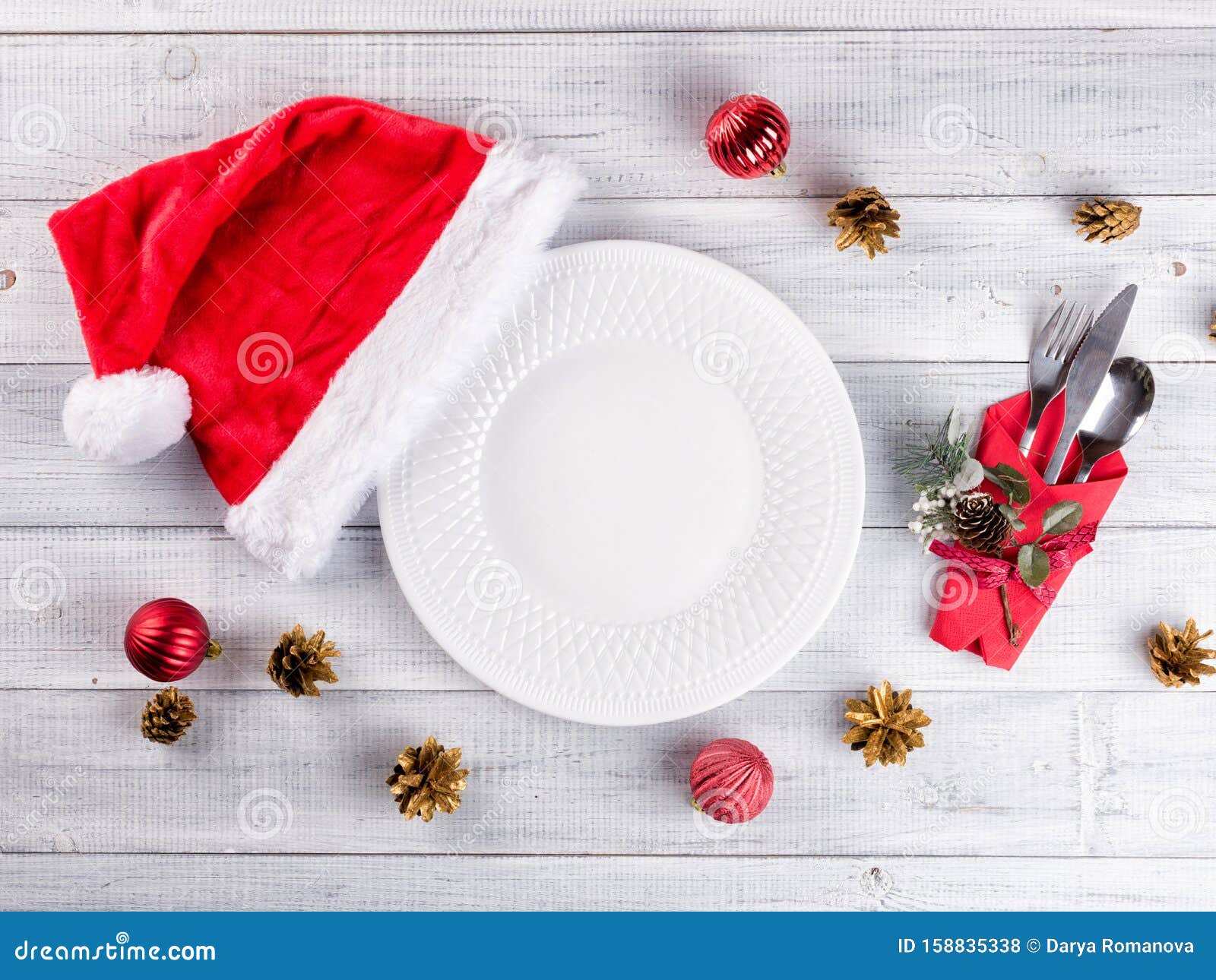 Christmas Table Setting with an Empty Plate and Red Santa Hat Stock ...