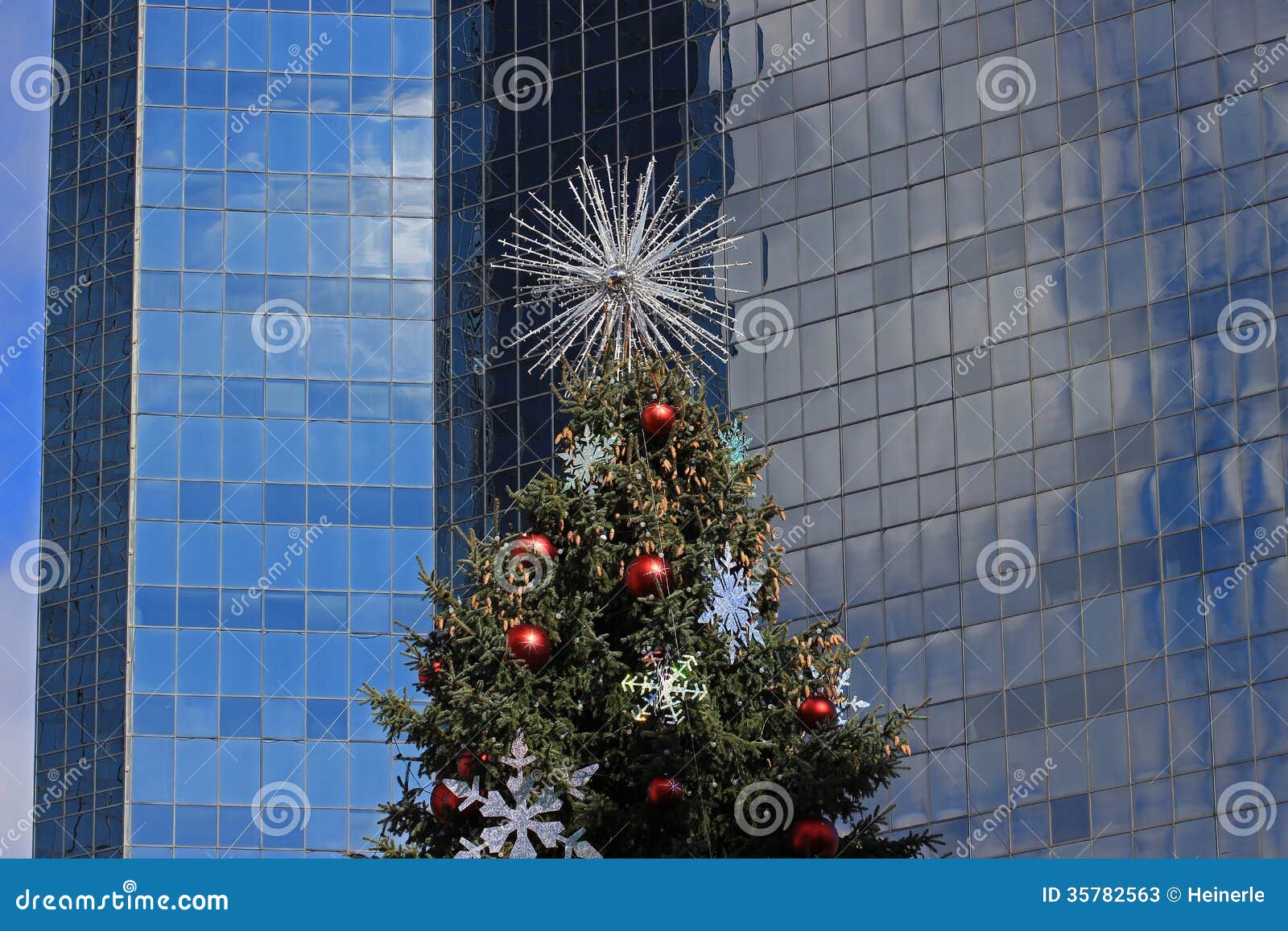 Christmas Tree Against Blue Skyscraper Background Stock Image - Image ...