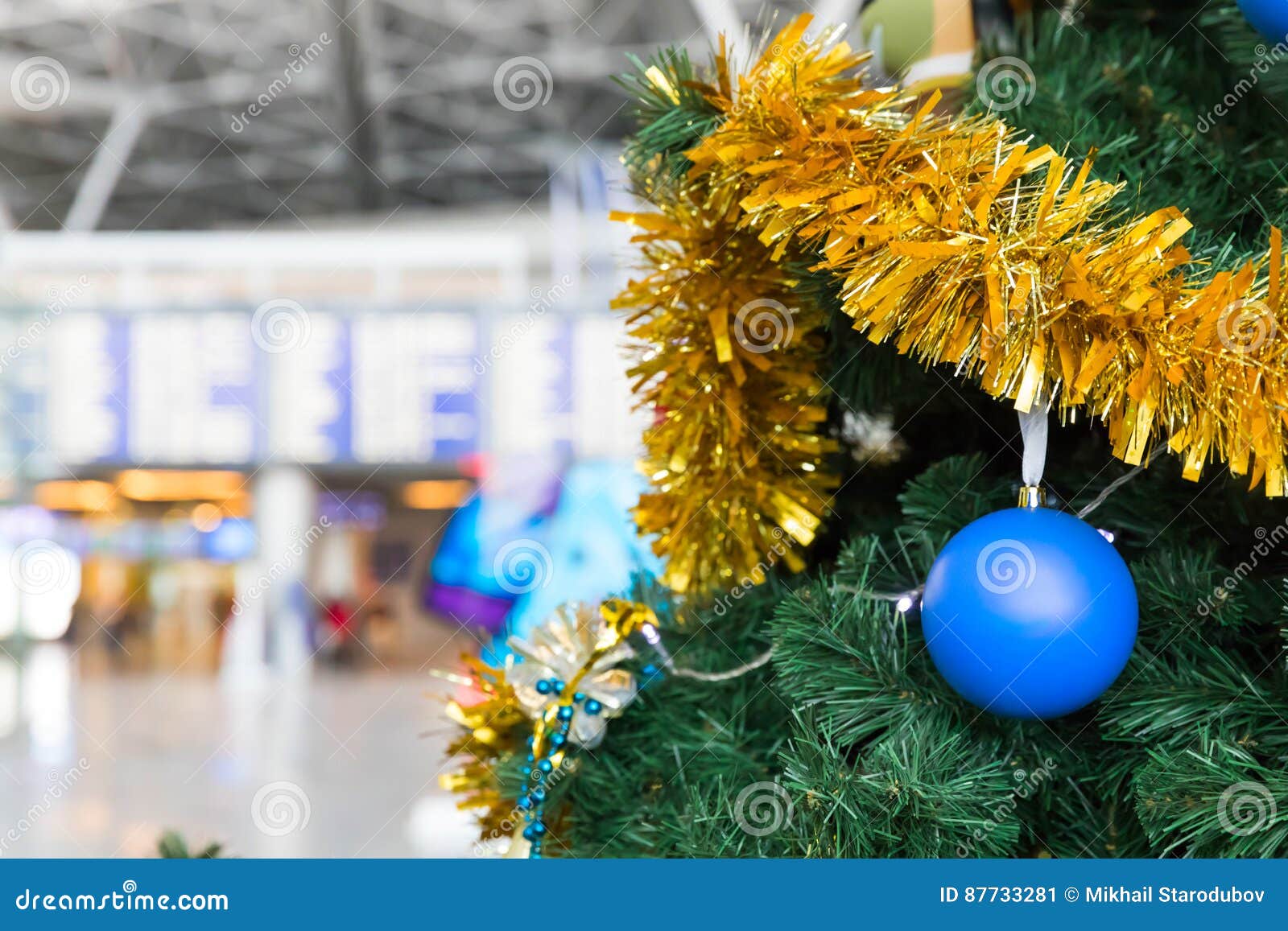 Christmas Tree in the Airport and Flight Schedule Information Board ...