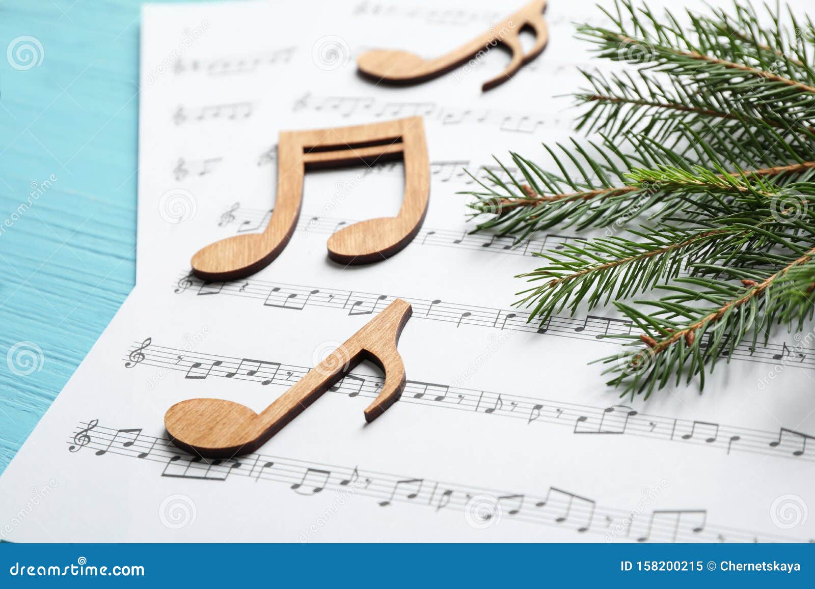 Christmas Tree Branch, Notes and Music Sheets on Table Stock Image ...