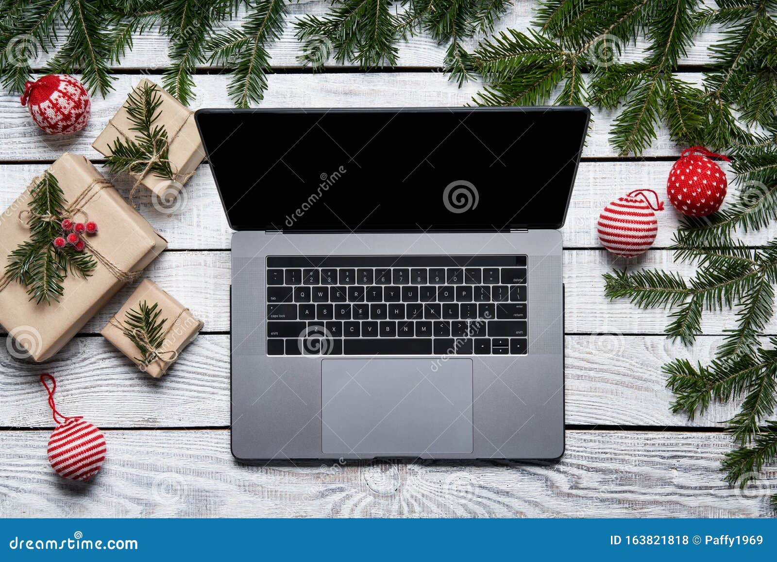 Christmas Tree Branches and Gift Boxes on Rough White Planks with ...