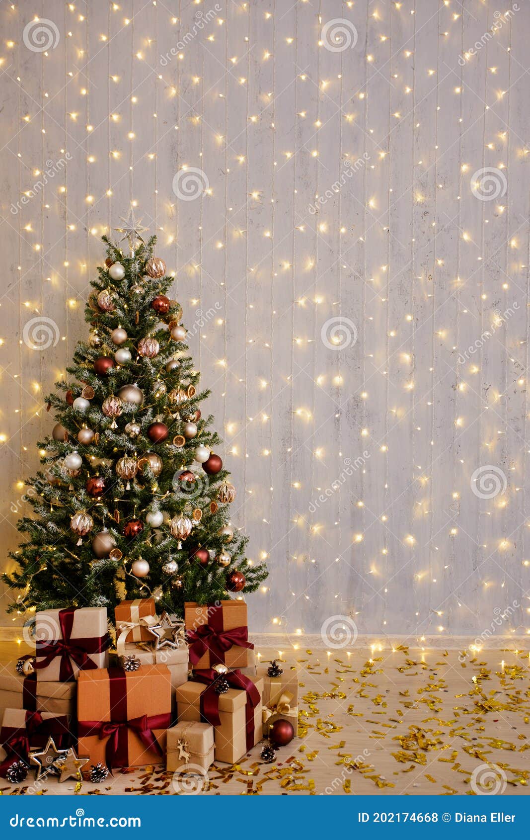 Christmas Tree with Gifts Over Wall with Led Lights Stock Photo - Image ...