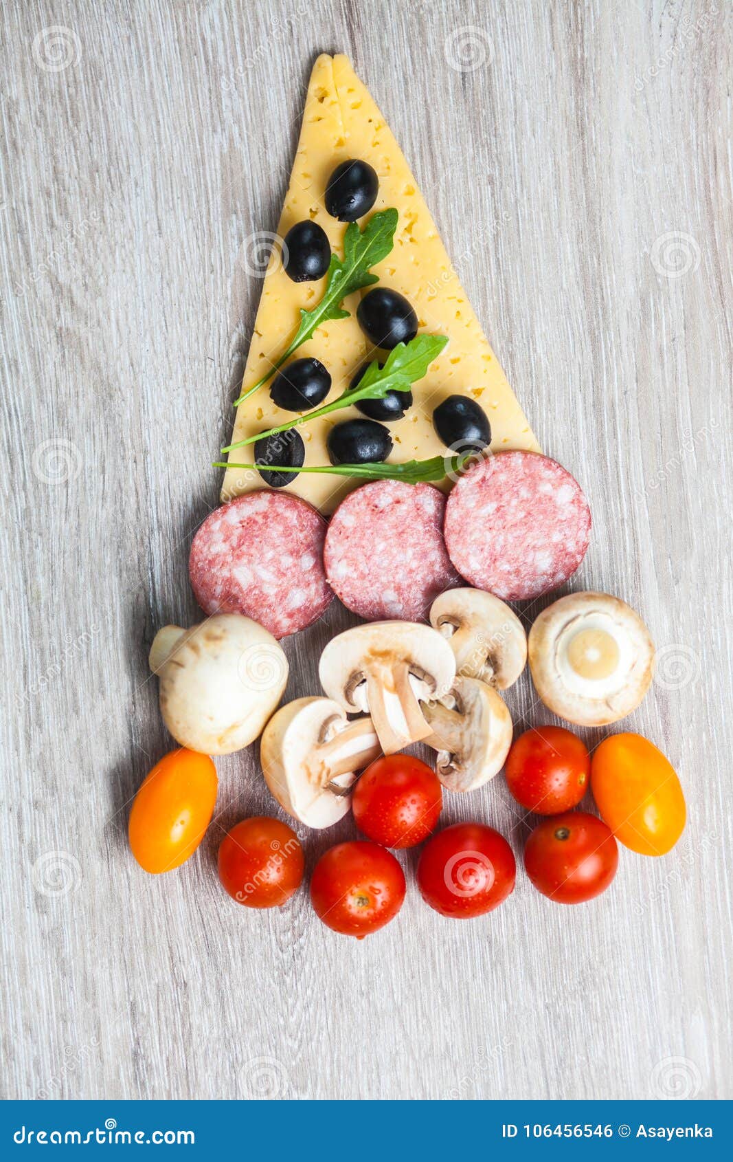 Christmas Tree Shaped Pizza with Cherry Tomatoes and Olives Stock Photo ...
