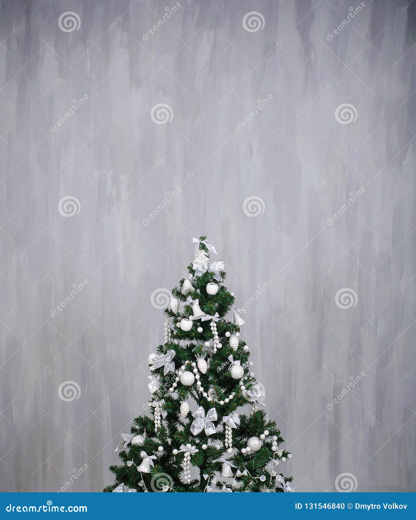 Christmas Tree with White Decorations on a Grey Texture Background ...