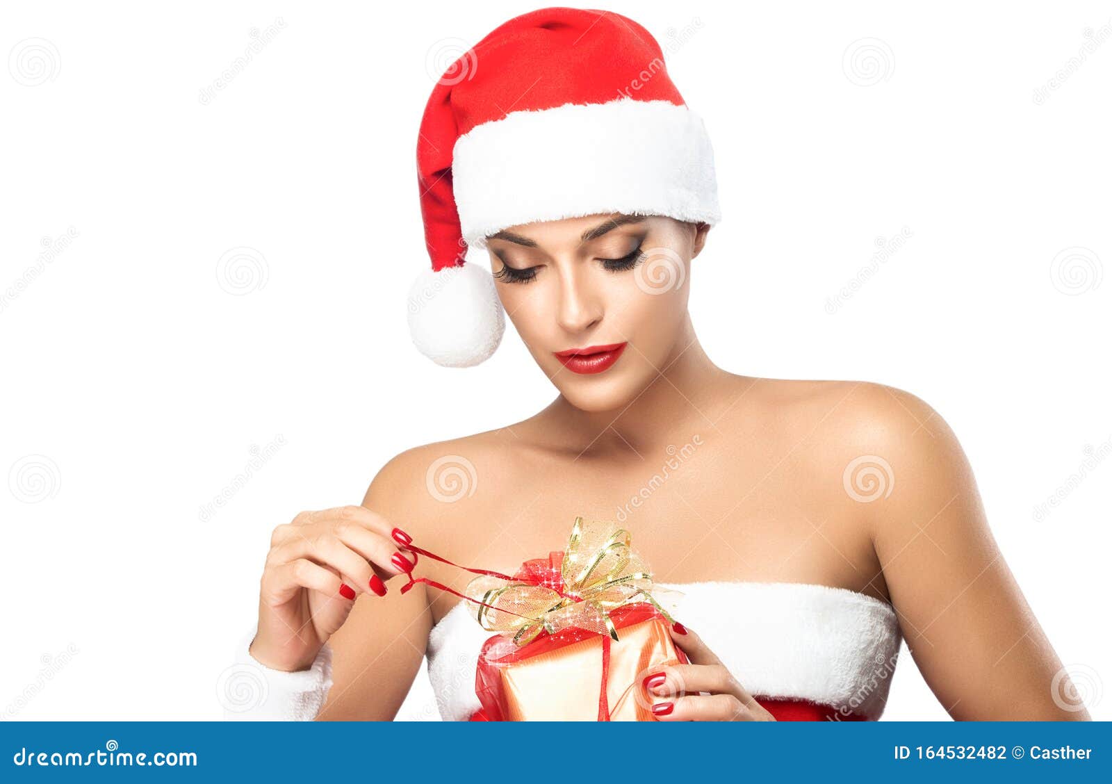 Christmas Woman in Santa Clothes Unwrapping Gift Stock Photo - Image of ... Christmas Woman in Santa Clothes Unwrapping Gift Stock Photo - Image of ...