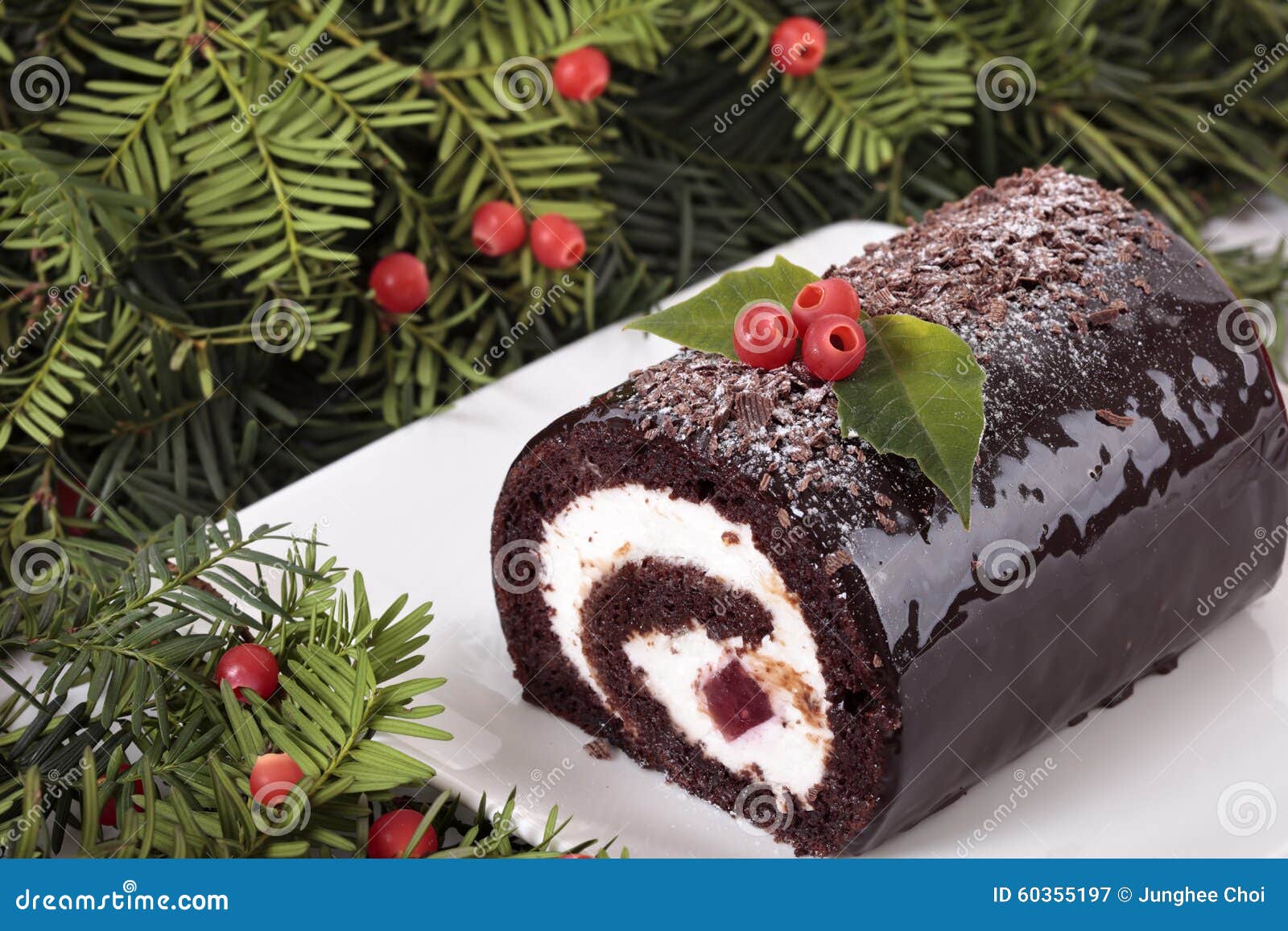 Christmas Yule Log Cake on Plate Under Tree Stock Image - Image of ...