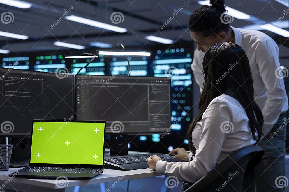 Chroma Key Notebook in Front of Engineers Fixing Server Racks Rows ...