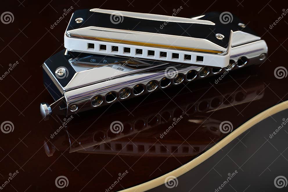 Chromatic and Diatonic Harmonica Stack on Back of Acoustic Guitar Stock ...