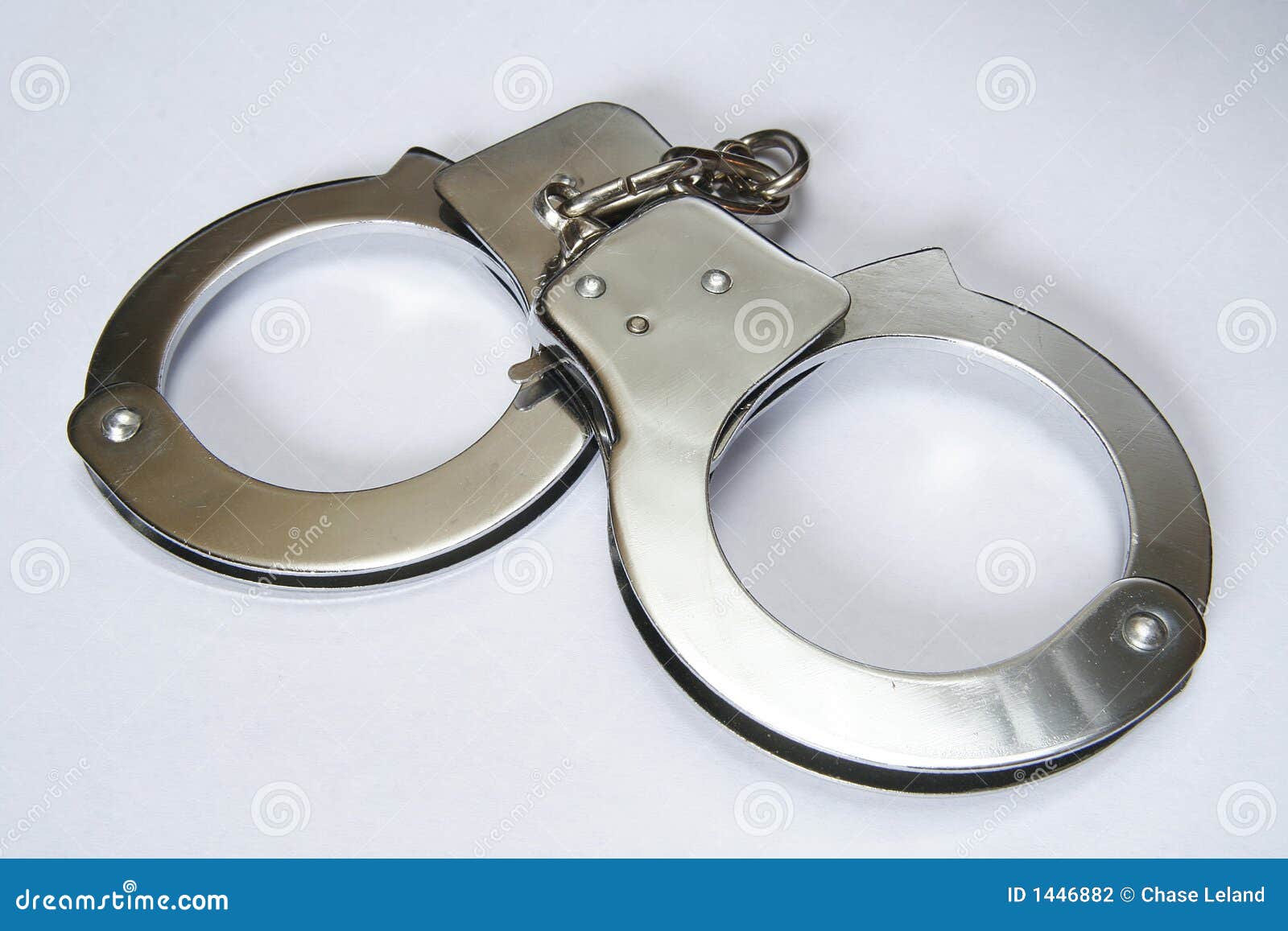 Chrome handcuffs stock photo. Image of justice, authority - 1446882