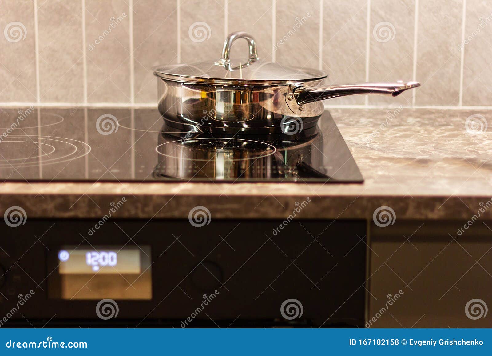 Chrome Pan on Electric Stove . Kitchenware Accessories Stock Photo ...