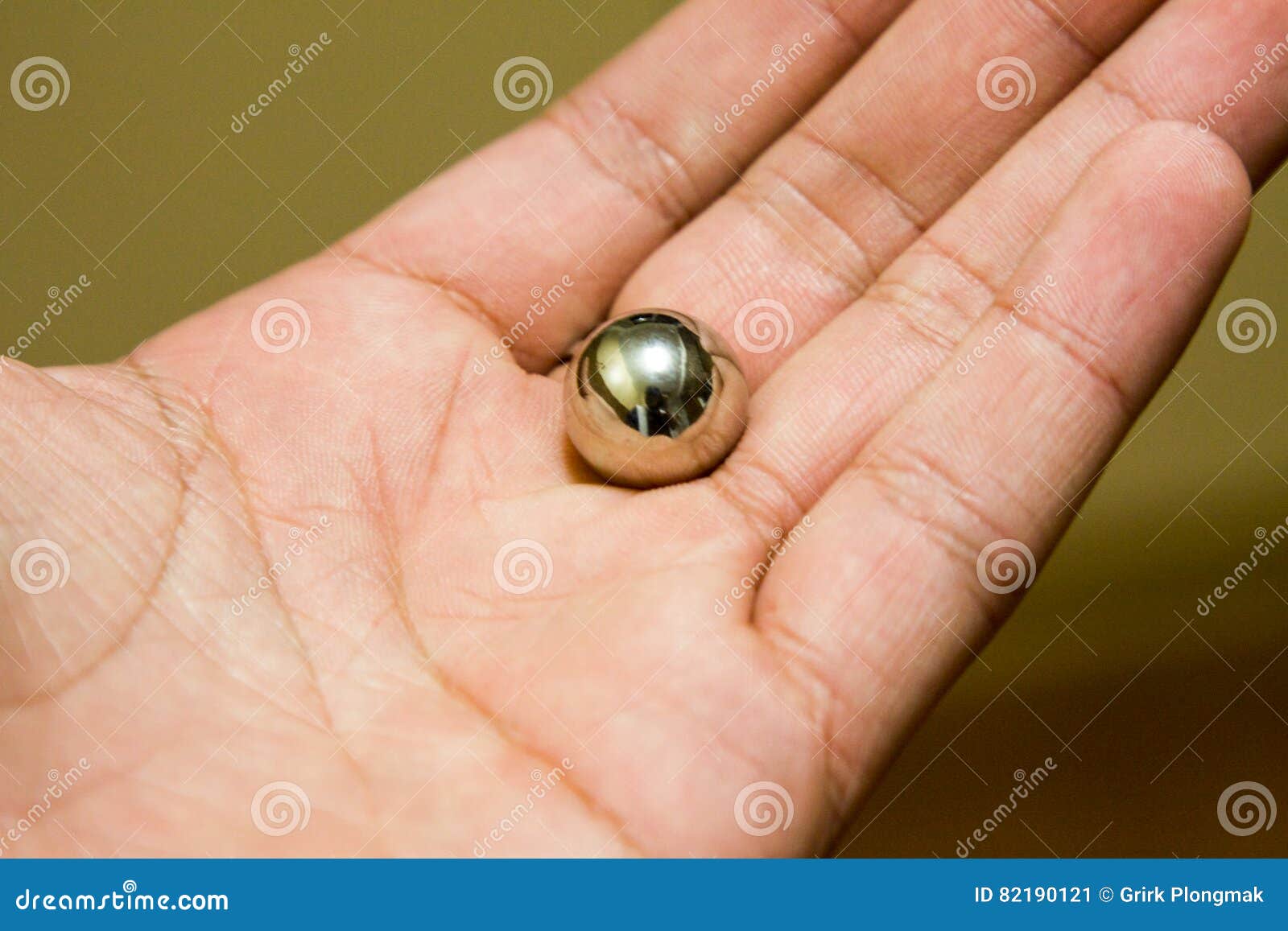 Chrome Spheres in Palm of Hand. Stock Image - Image of light, bearing ...