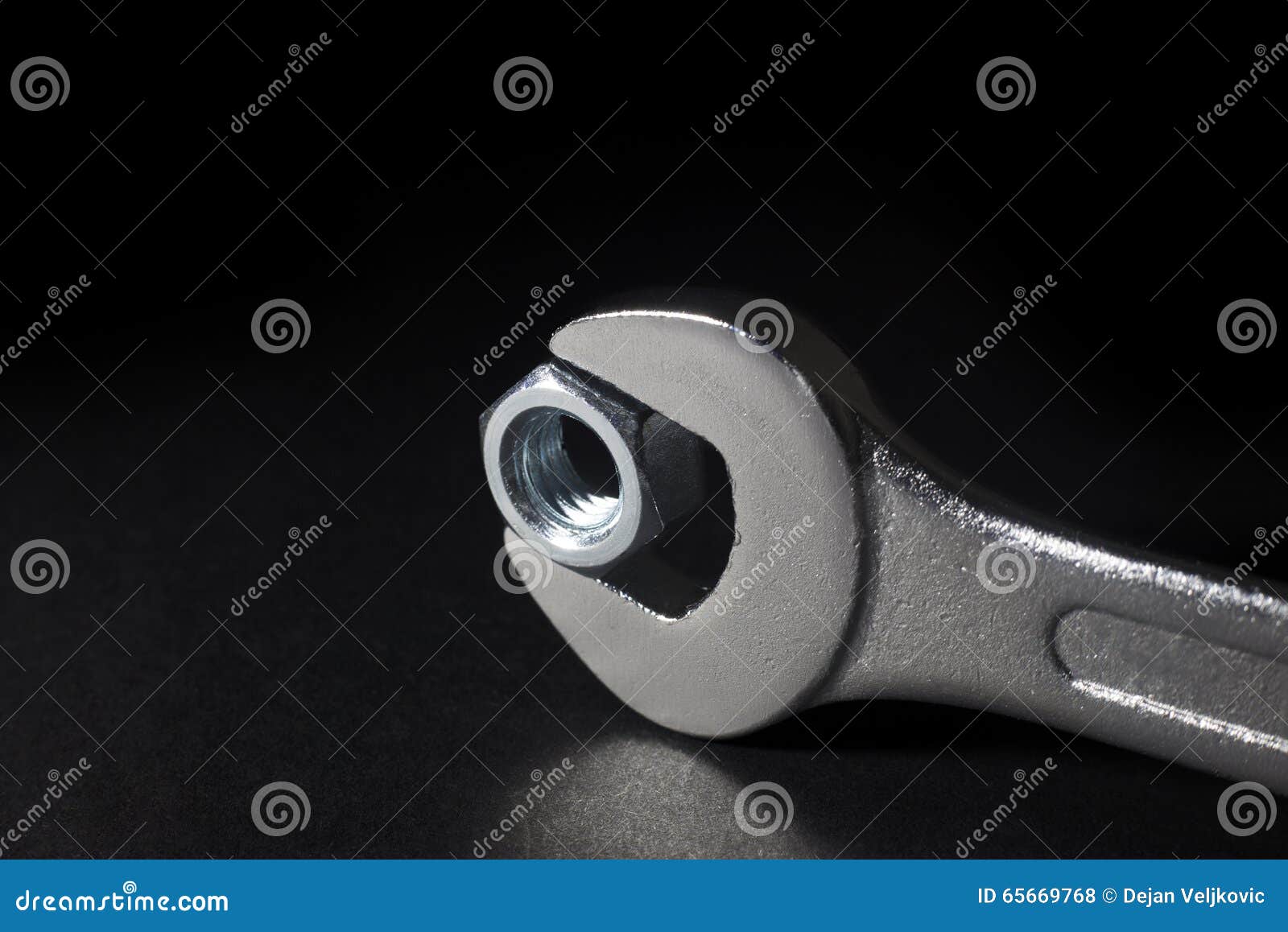 Chrome-Vanadium Spanner Gripping Nut on Black Stock Photo - Image of ...