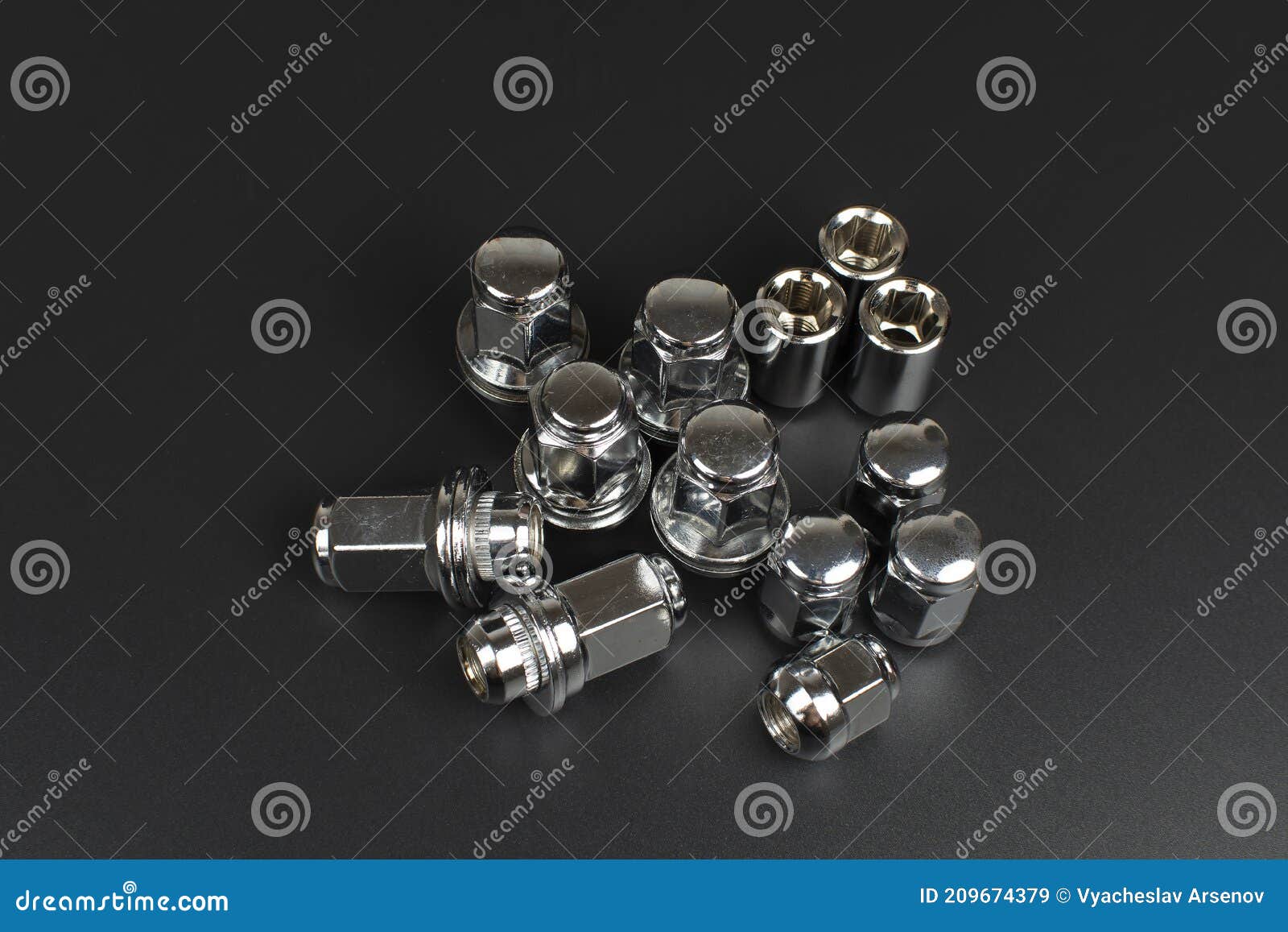 Chrome Wheel Nuts Group on Black Background Stock Image - Image of ...