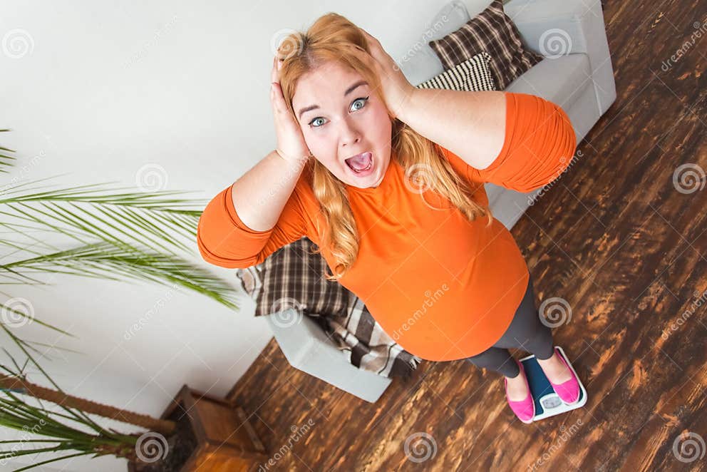 Chubby Woman Sport At Home Standing Holding Head Screaming Shocked Top View Stock Image Image