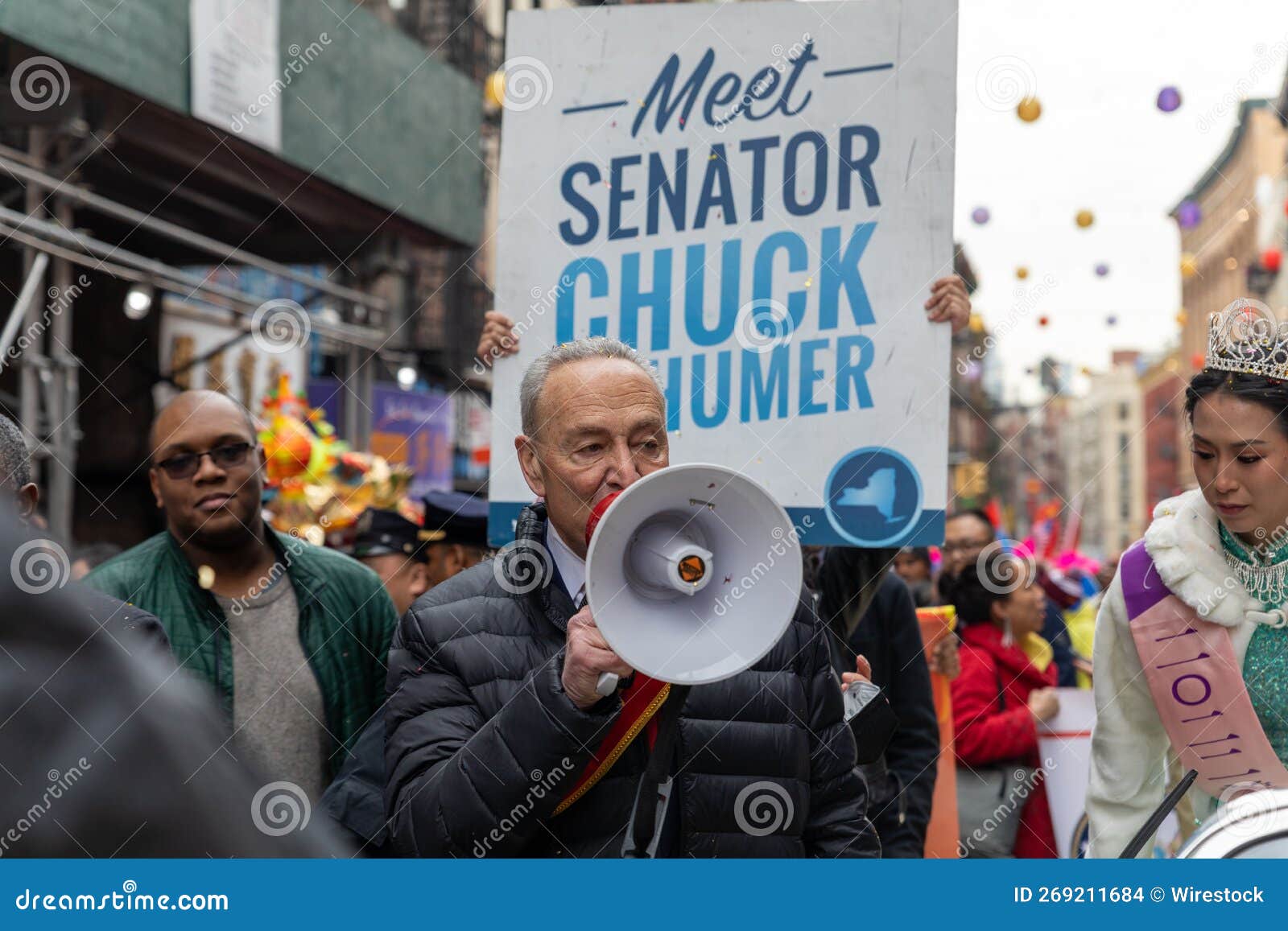 Chuck Schumer Standing in Front of a Crowd, Raising a Megaphone and ...