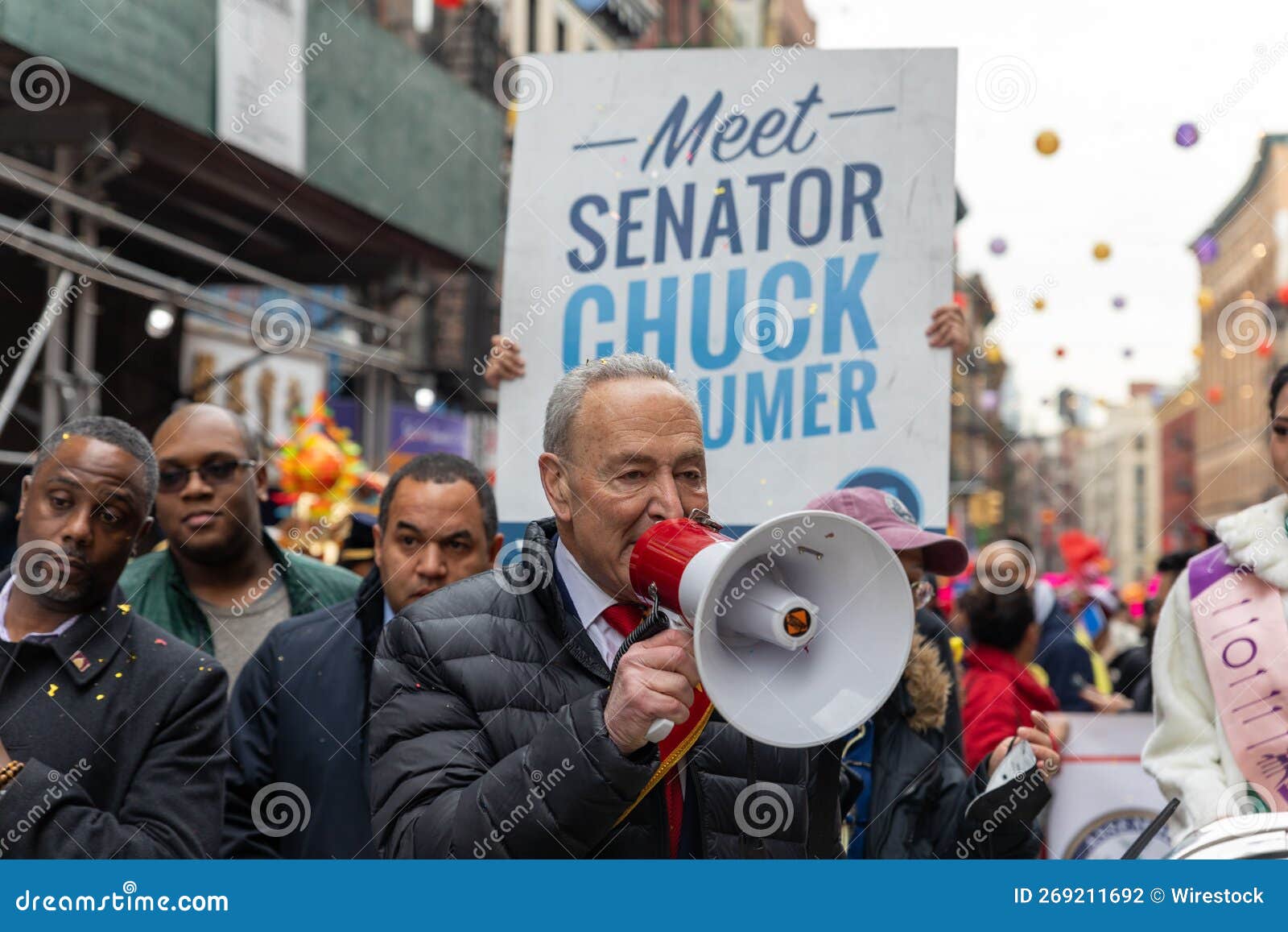 Chuck Schumer Standing in Front of a Crowd, Raising a Megaphone and ...